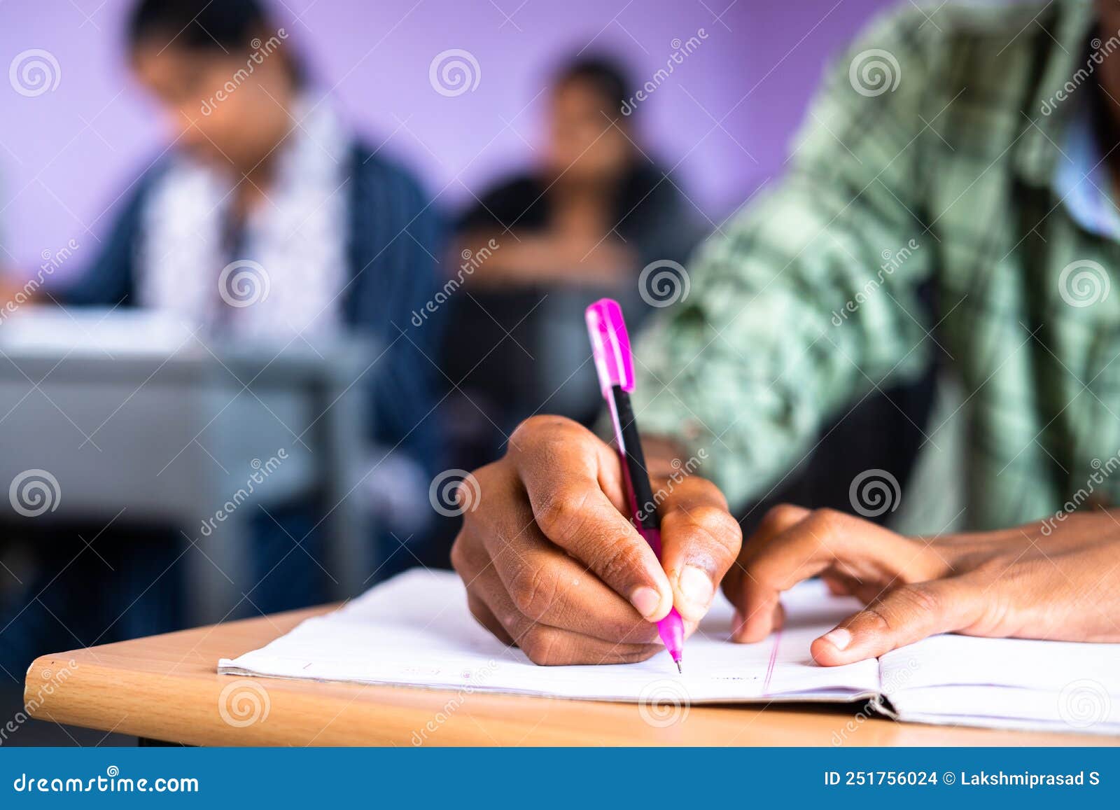 Close Up Shot of College Student Writing Notes on Book at Classroom ...