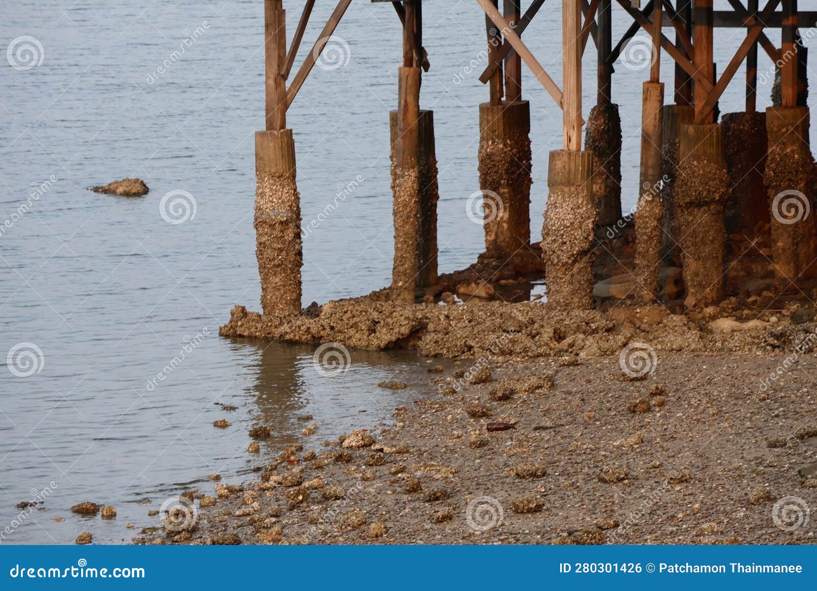 A Close-up Shot of a Concrete Pillar that Has Been Eroded by the Sea ...
