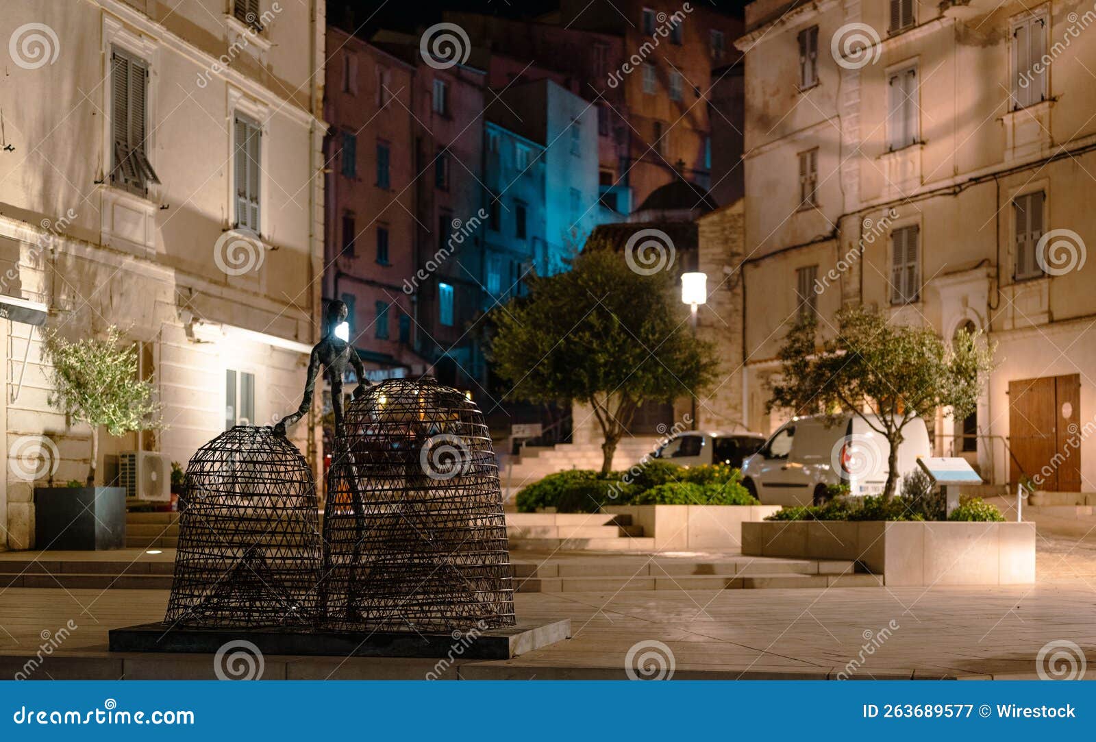 Close-up Shot of a Creative Sculpture in a Yard between Buildings ...