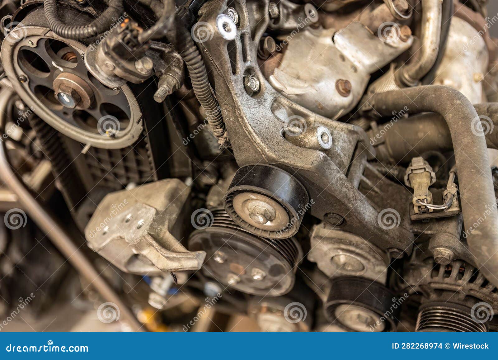 Close-up Shot of the Engine of a Car Surrounded by Various Mechanical ...
