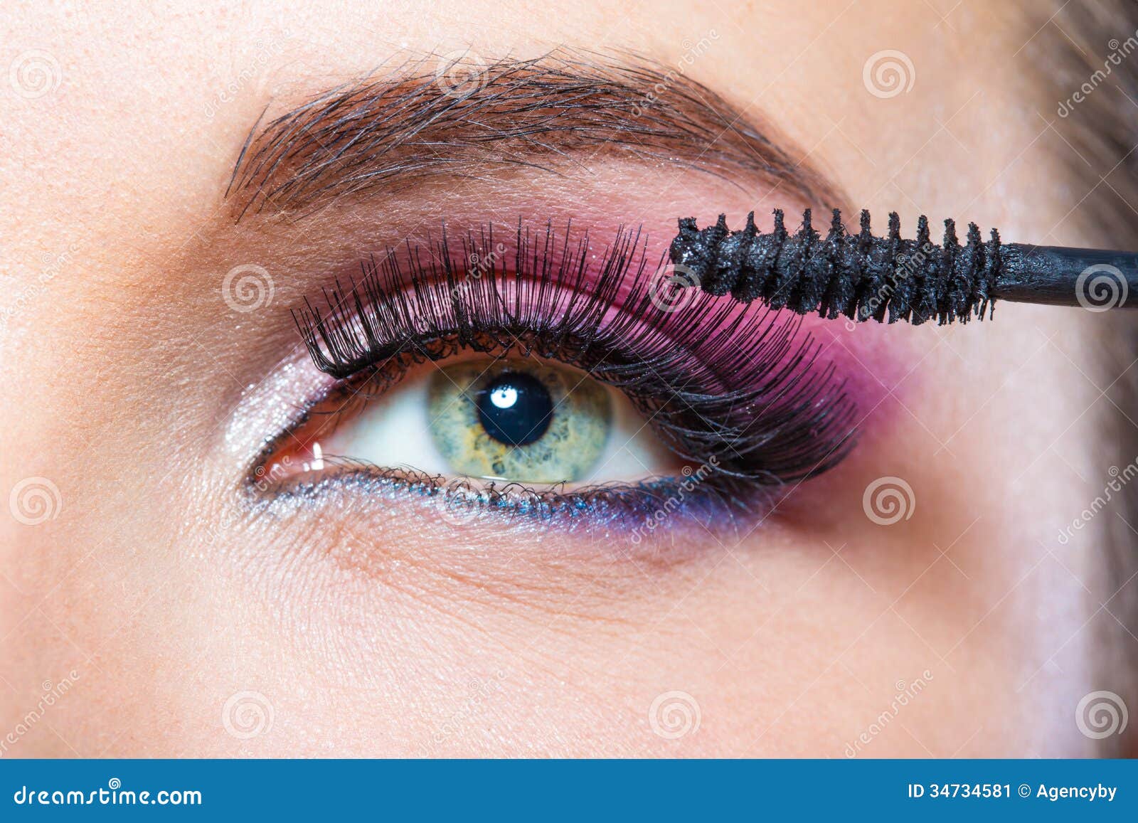 Close Up Shot of Female Eye and Brush Applying Mascara Stock Image ...