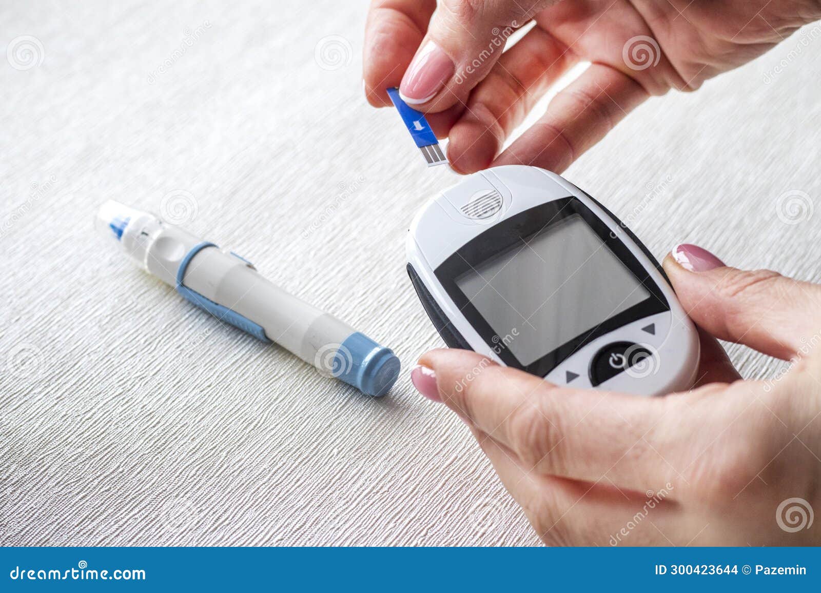 Close Up Shot of the Glucometer Instrument on the White Surface ...