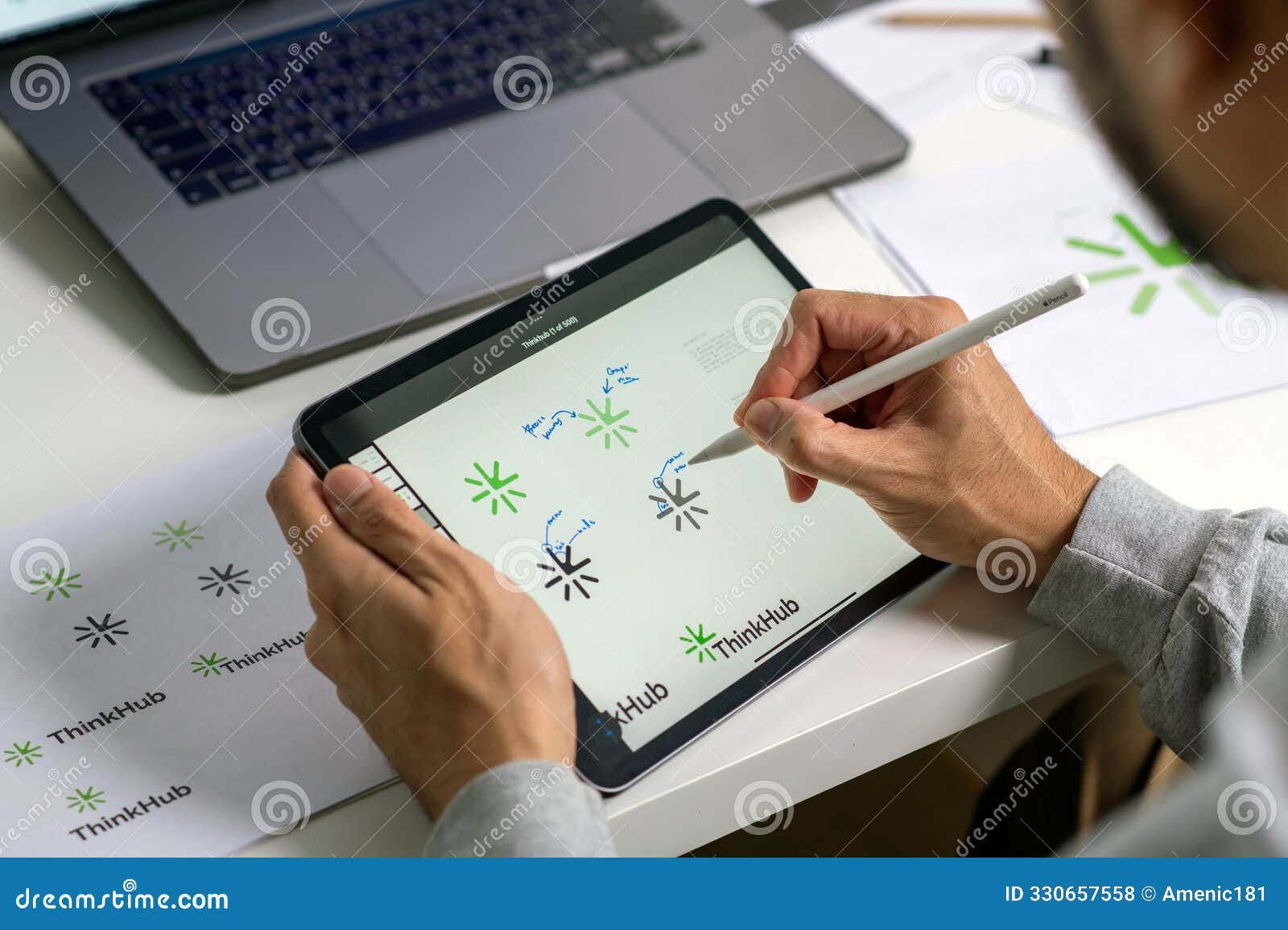 Graphic Designer Making Notes on Logo Designs, Designing Logos, and ...