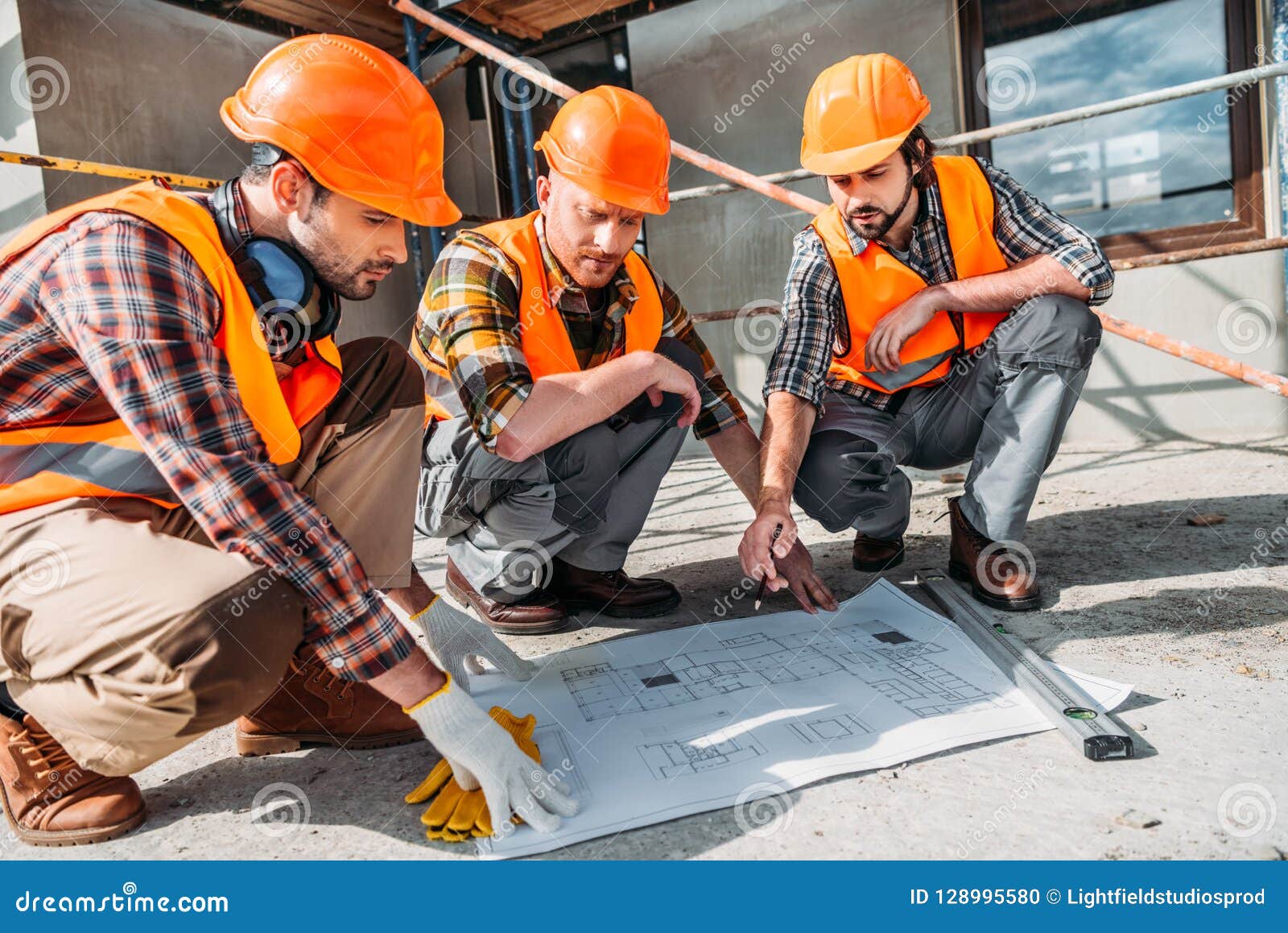 Close-up Shot of Group of Builders Having Conversation about Stock ...