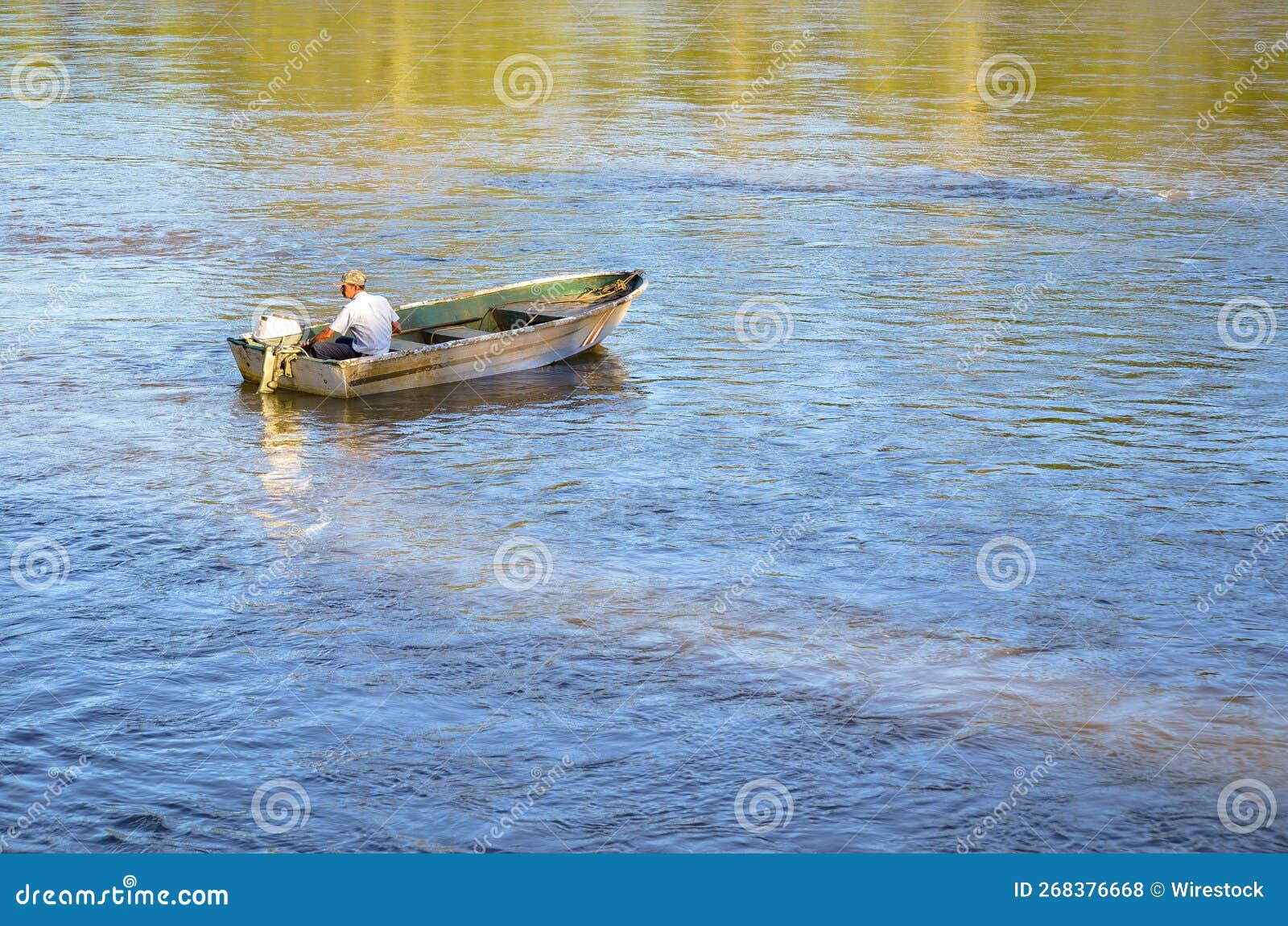 Close-up Shot of a Man Driving a Boat in the Water Stock Photo - Image ...