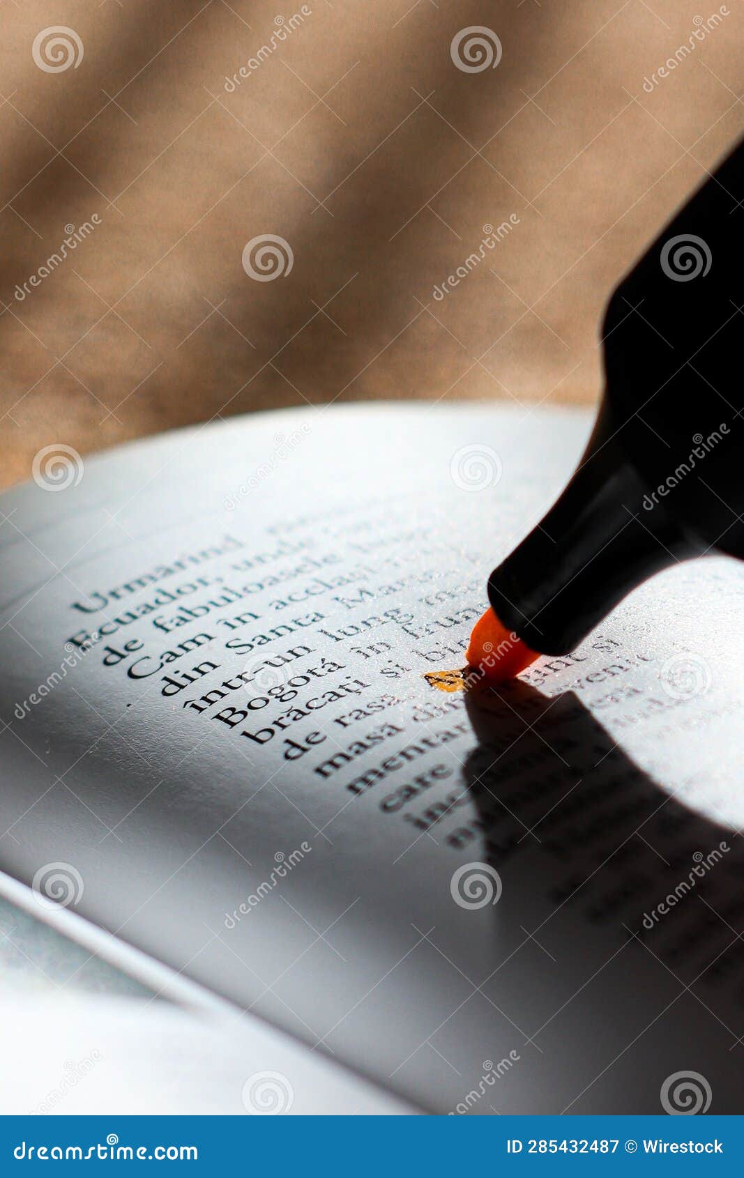 Close-up Shot of a Marker Highlighting a Line in a Book Stock Image ...