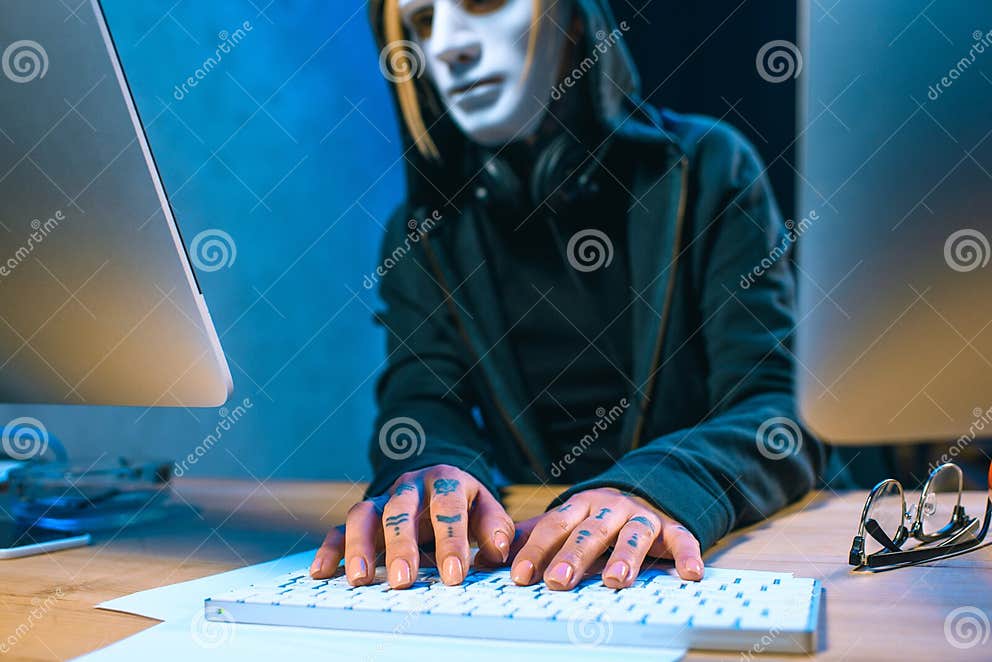 Close-up Shot of Masked Female Hacker with Tattoos on Hands Stock Image ...