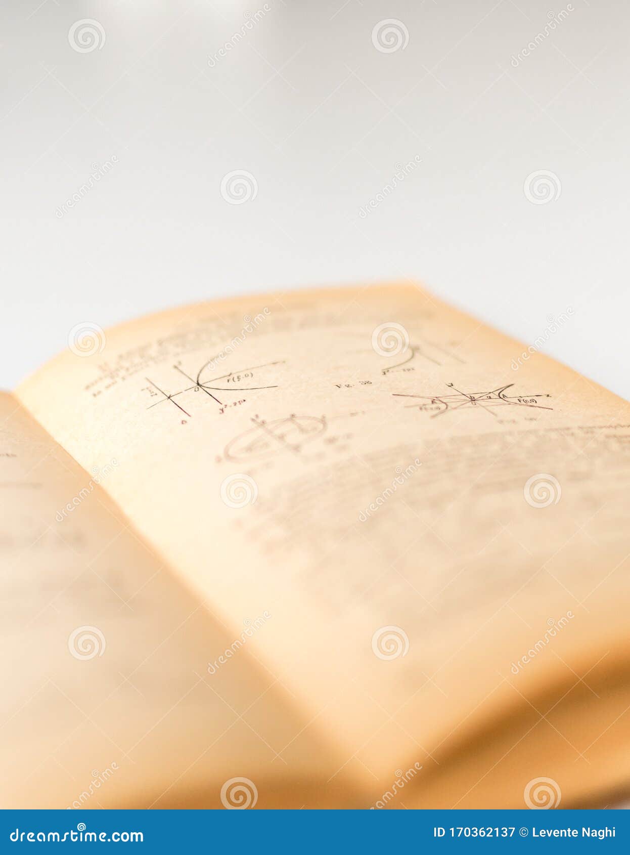 Close Up Shot of an Open Old Science Book Containing Equations and ...