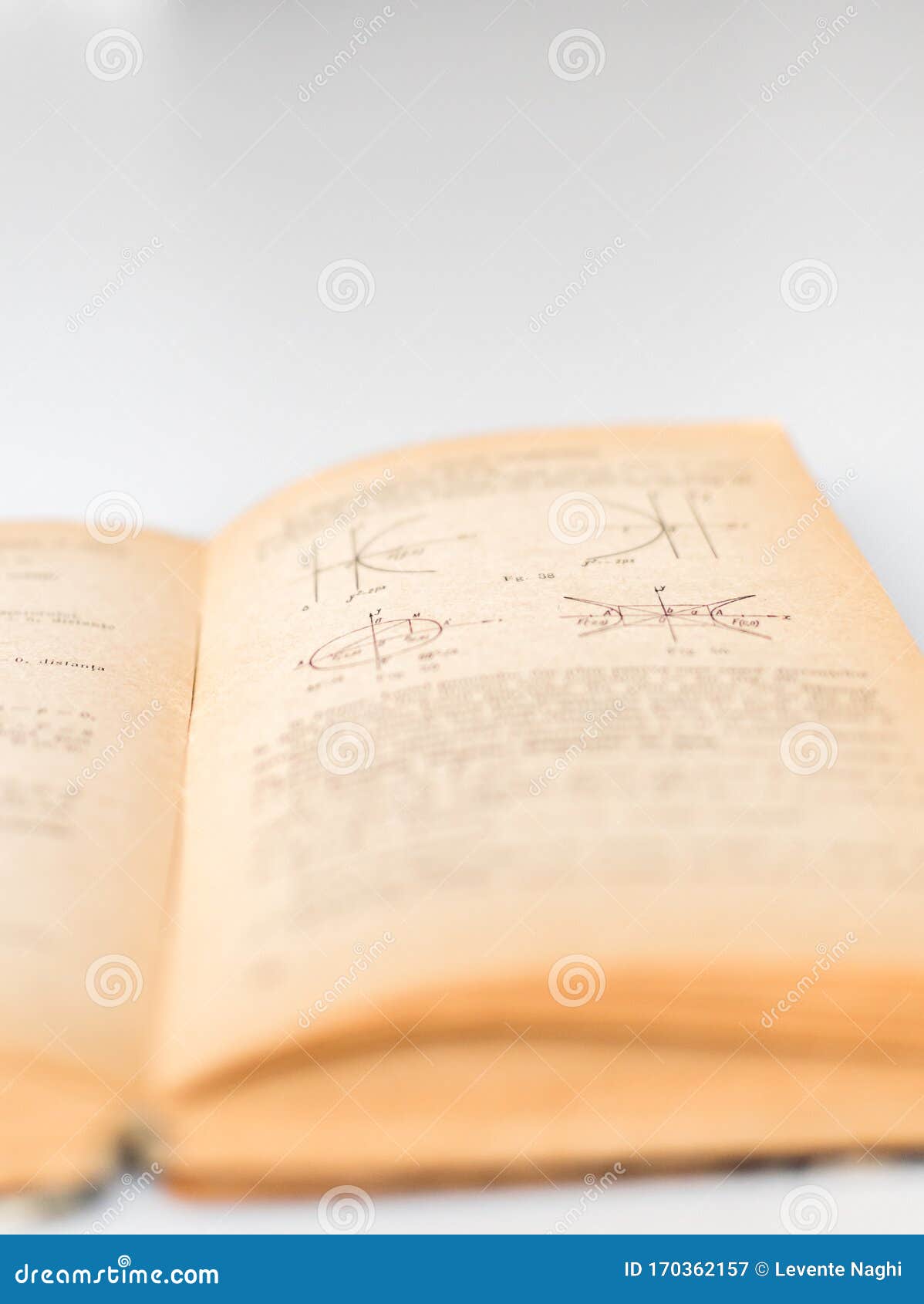 Close Up Shot of an Open Old Science Book Containing Equations and ...