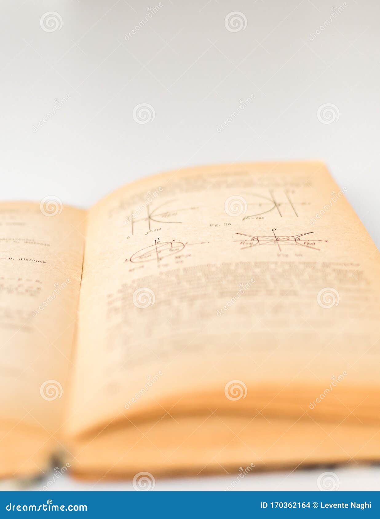 Close Up Shot of an Open Old Science Book Containing Equations and ...