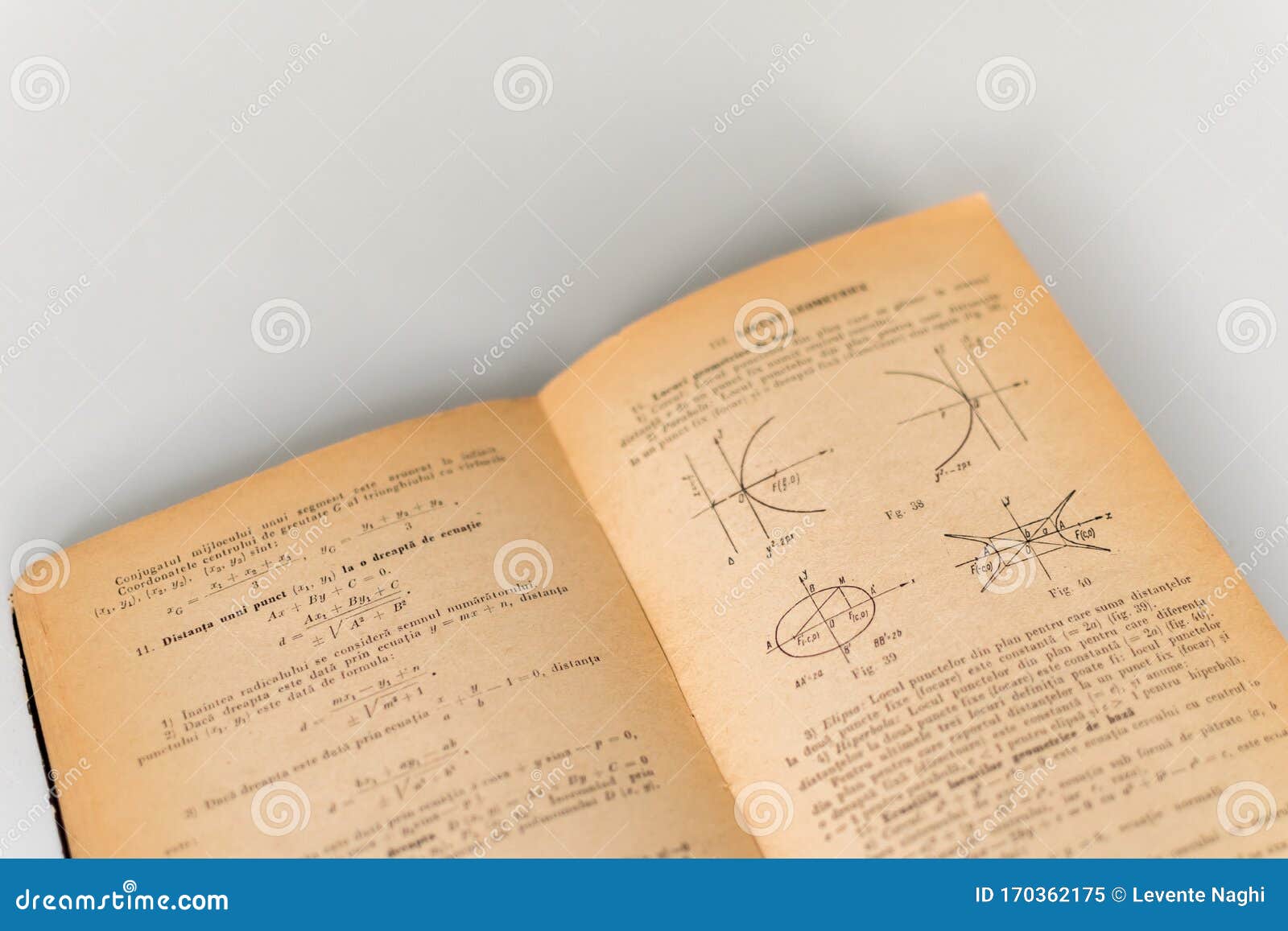 Close Up Shot of an Open Old Science Book Containing Equations and ...