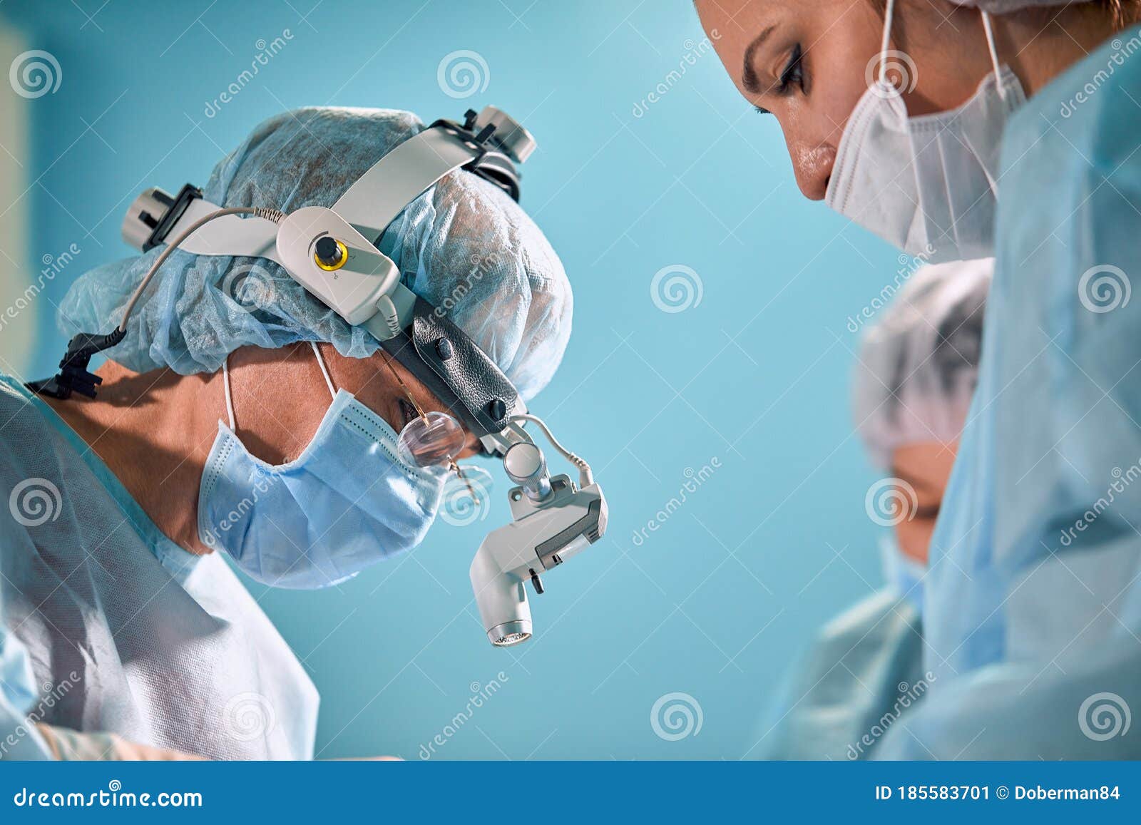 Close-up Shot in the Operating Room, Assistant Hands Out Instruments To ...
