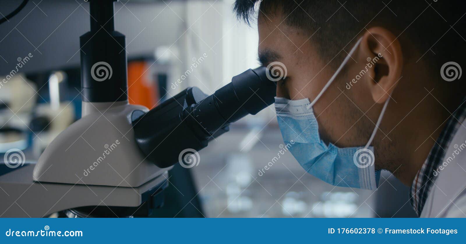 Scientist Studying Sample in Microscope Stock Photo - Image of ...