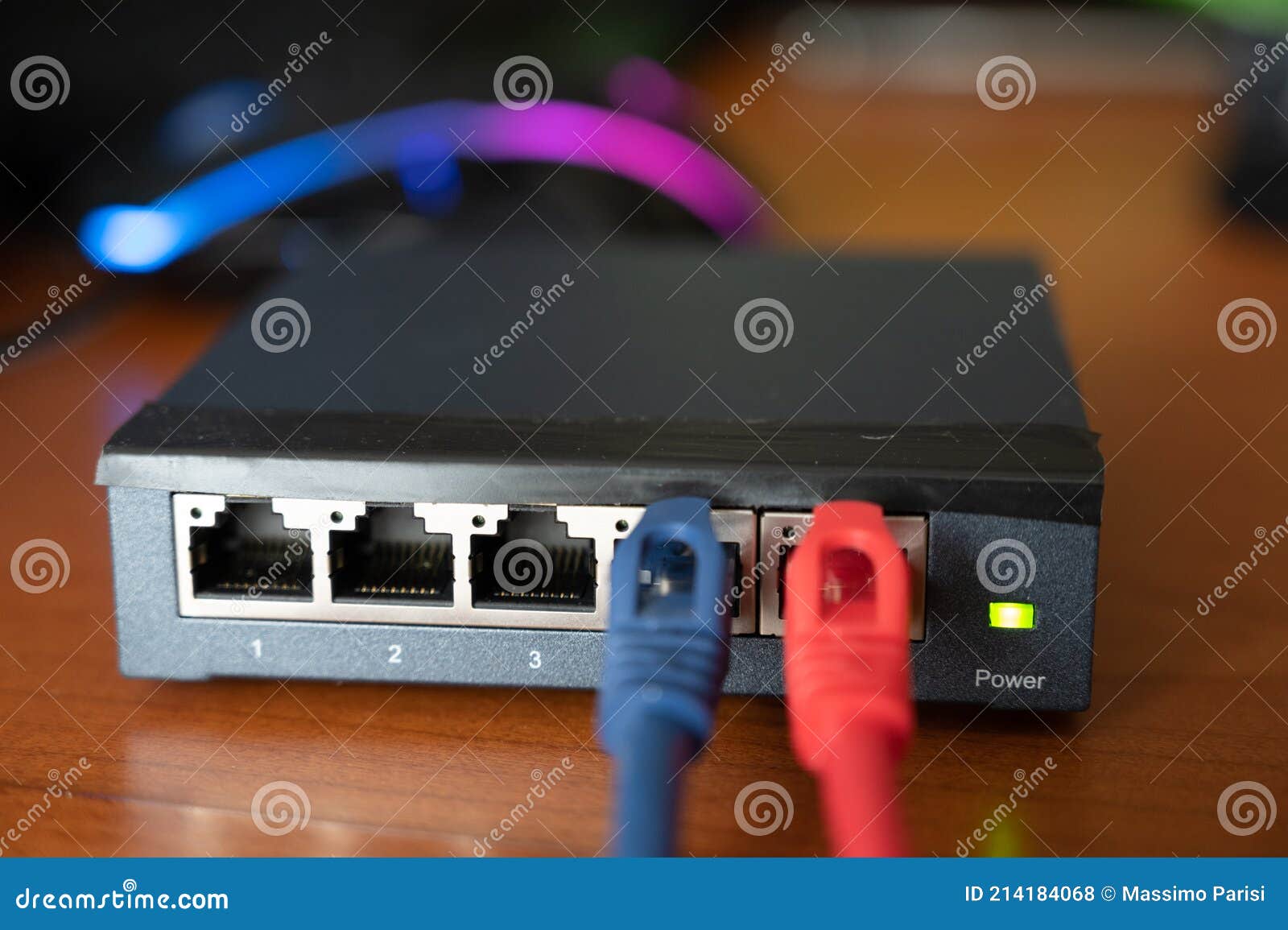 Close-up Shot Of A Router - A Red Cable Is Connected Next To The Blue ...