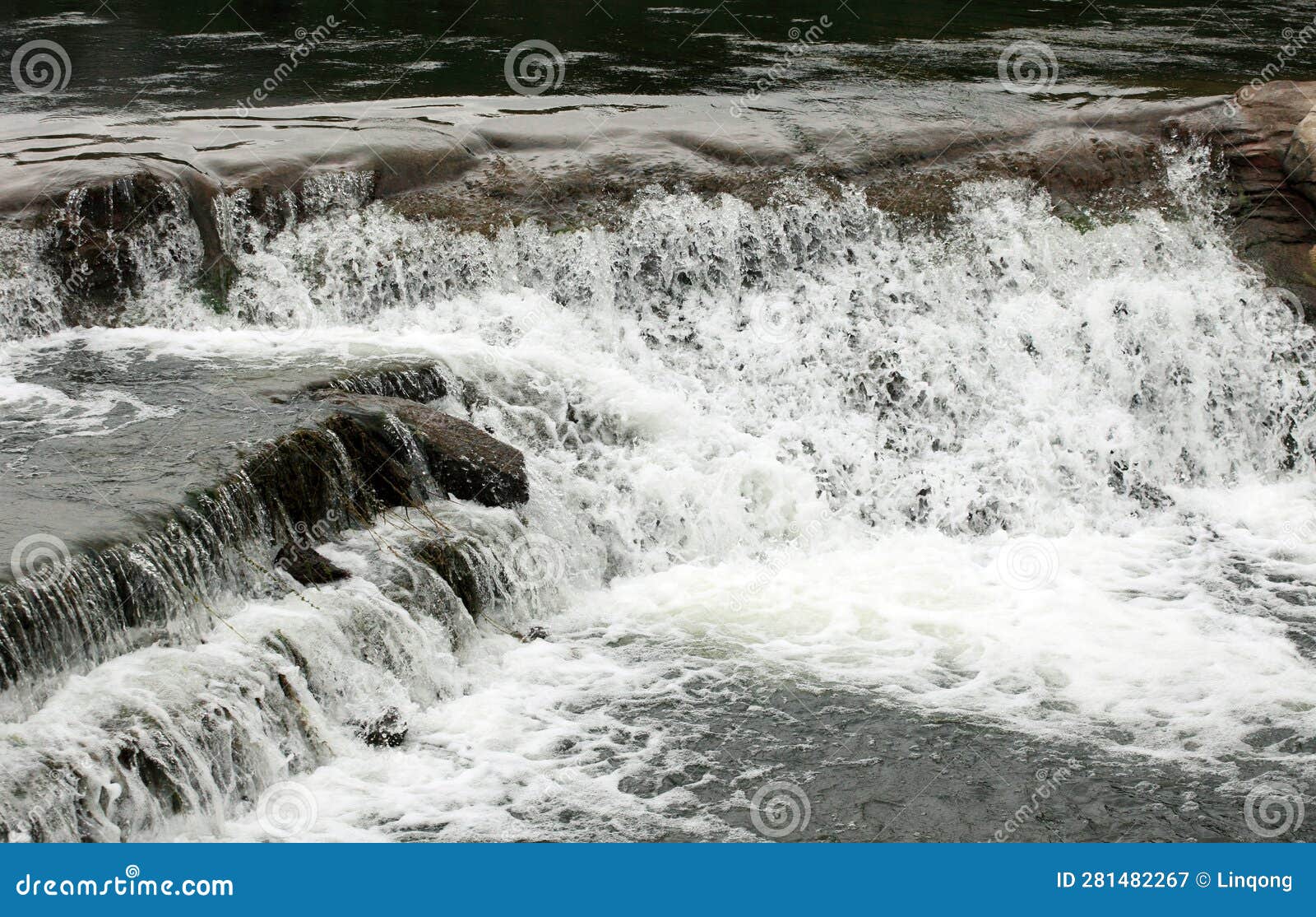 Rushing Stream Full Of Rocks With Green Field With Grass And Flowers ...