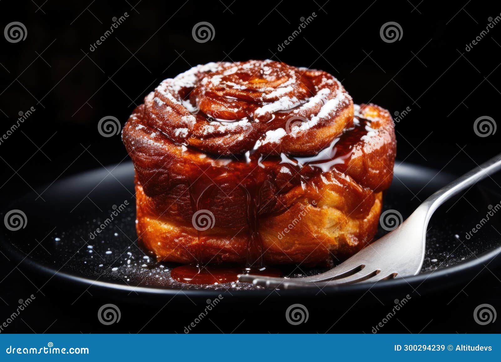 Close-up Shot of a Single Cinnamon Bun with a Fork Stock Image - Image ...