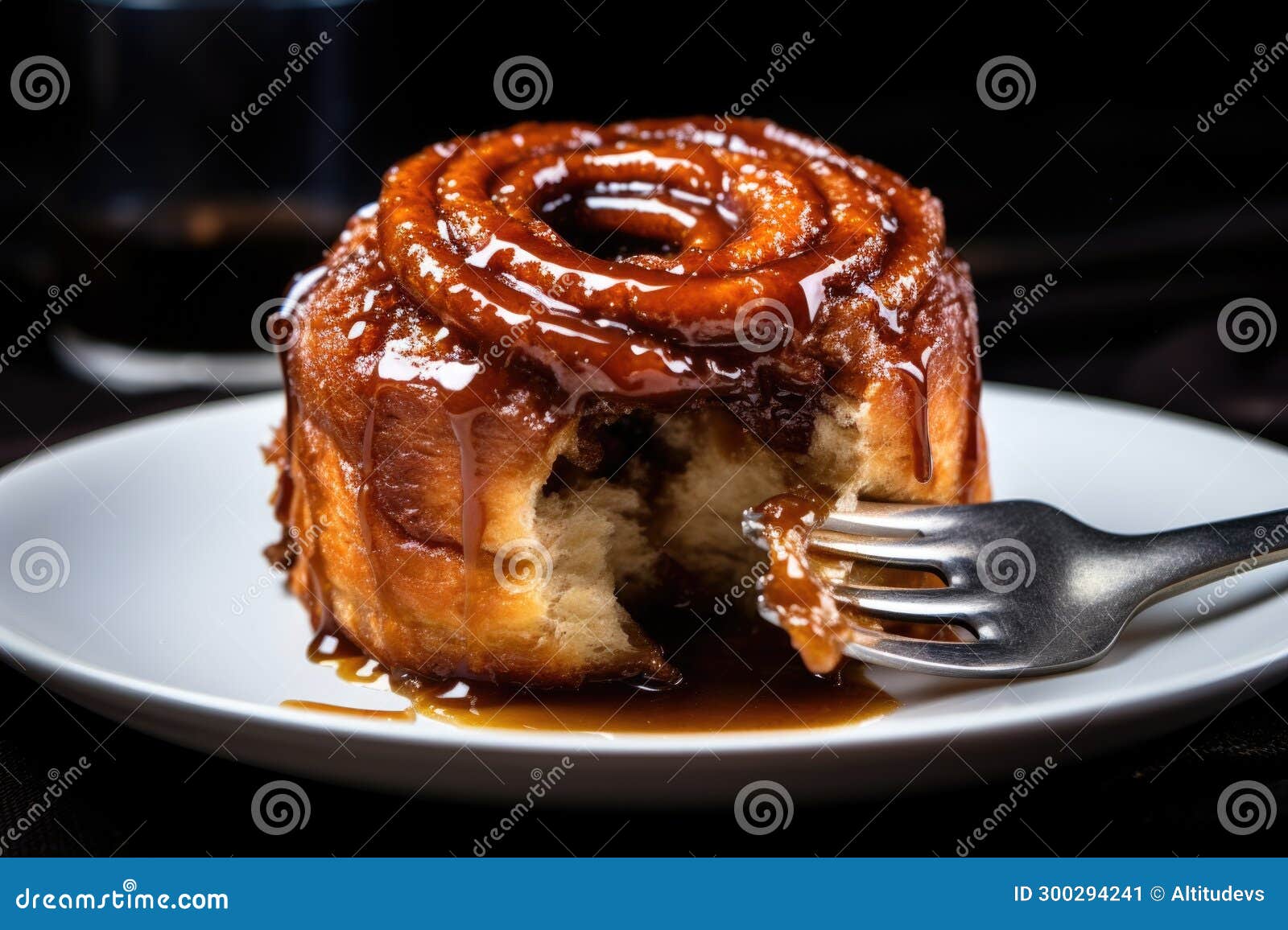 Close-up Shot of a Single Cinnamon Bun with a Fork Stock Image - Image ...