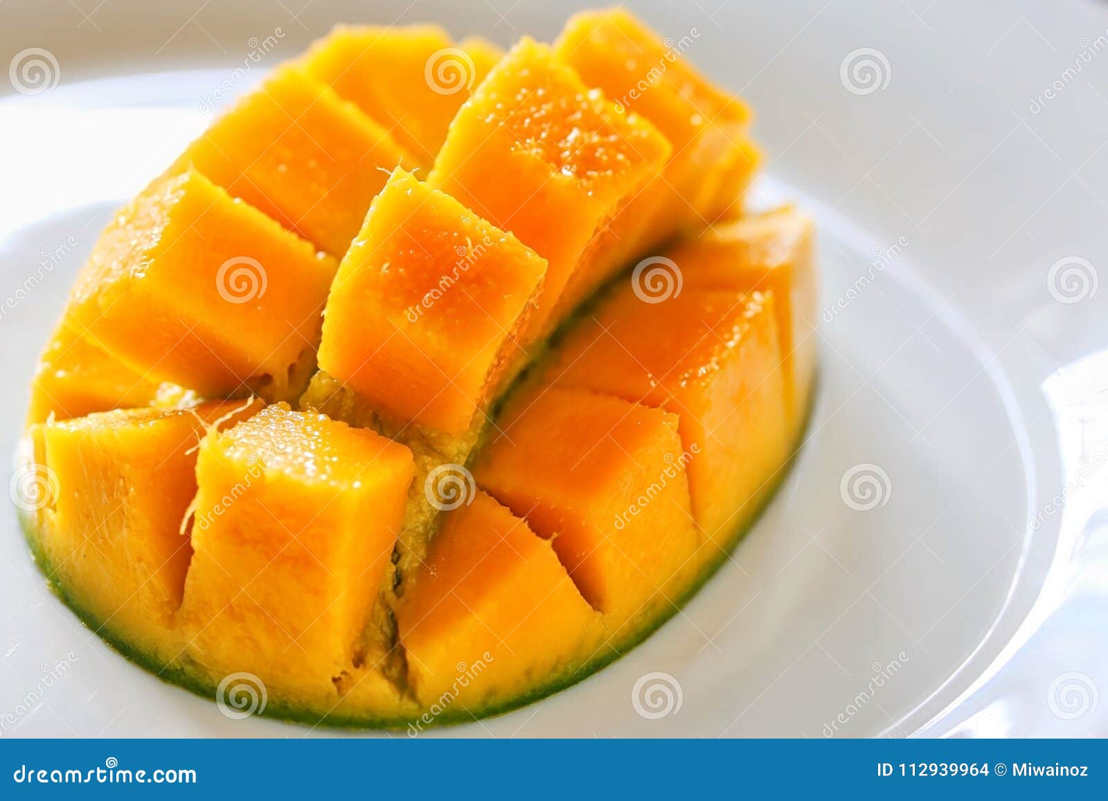 Fresh Juicy Mango on White Plate Stock Photo - Image of plate, food ...