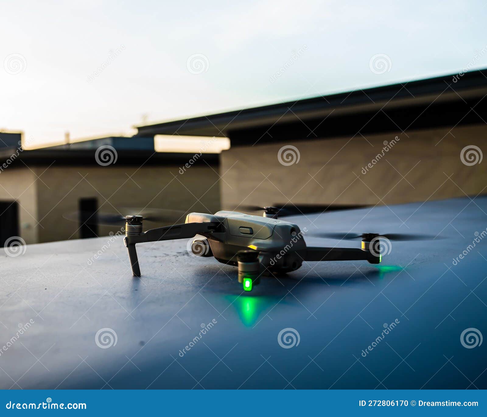 Close-up Shot of a Small Quadcopter Drone on a Rooftop, Its Four ...