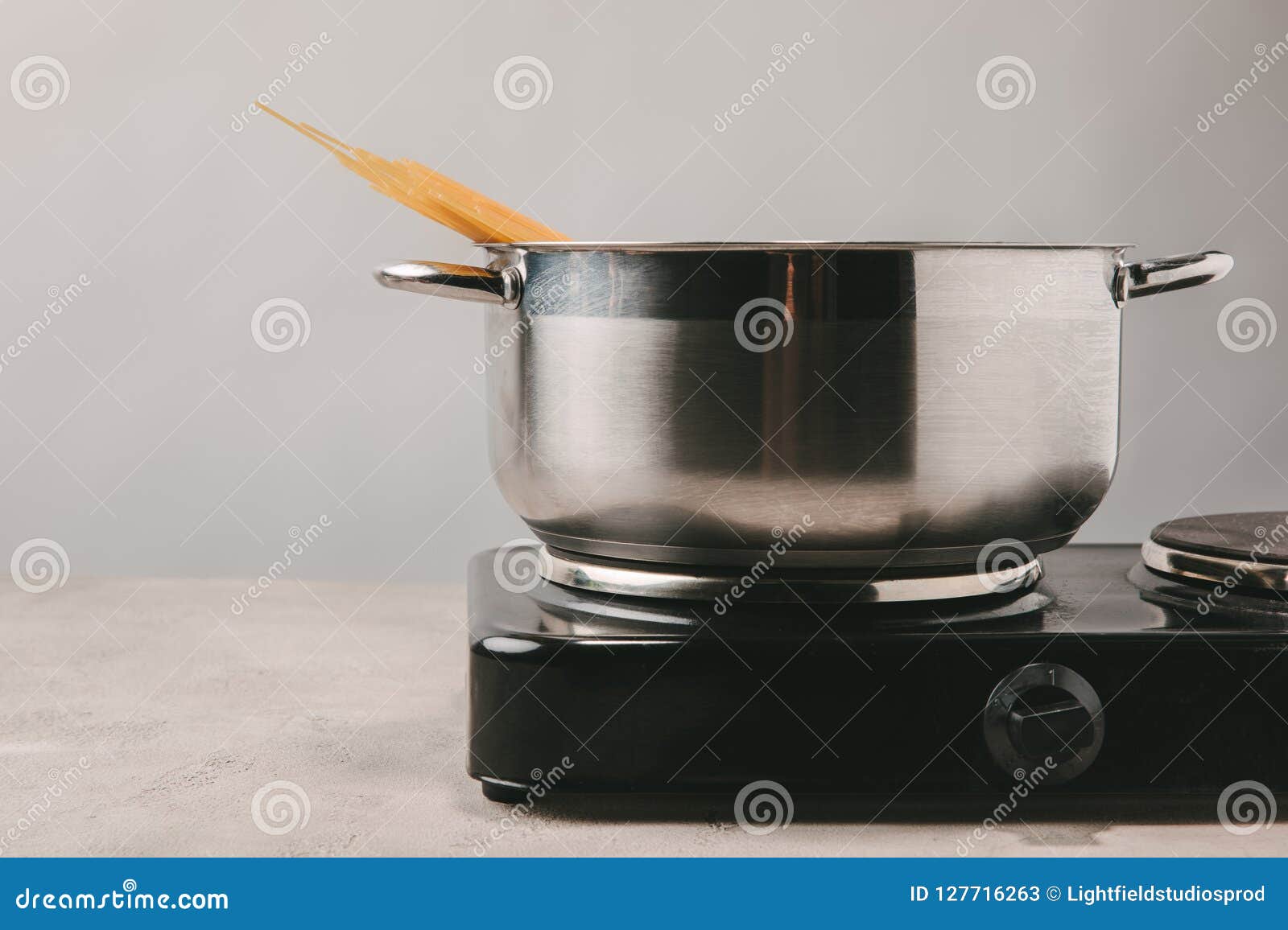 Close-up Shot of Spaghetti Boiling in Stewpot on Concrete Tabletop ...