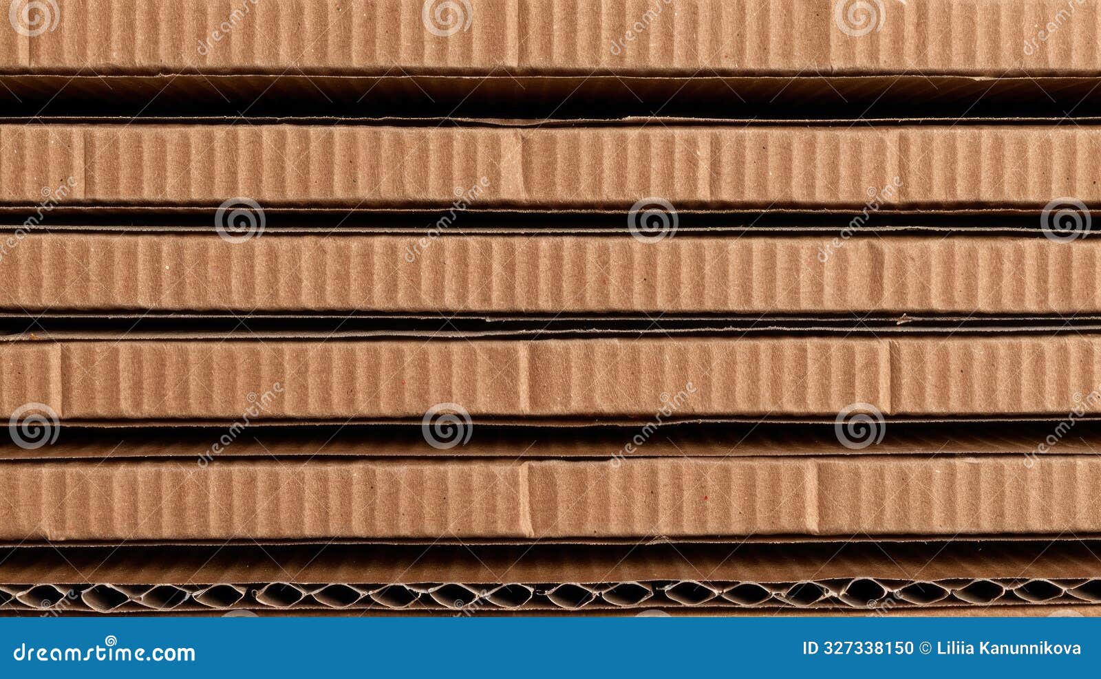 A Close-up Shot of a Stack of Brown Corrugated Cardboard Sheets. the ...