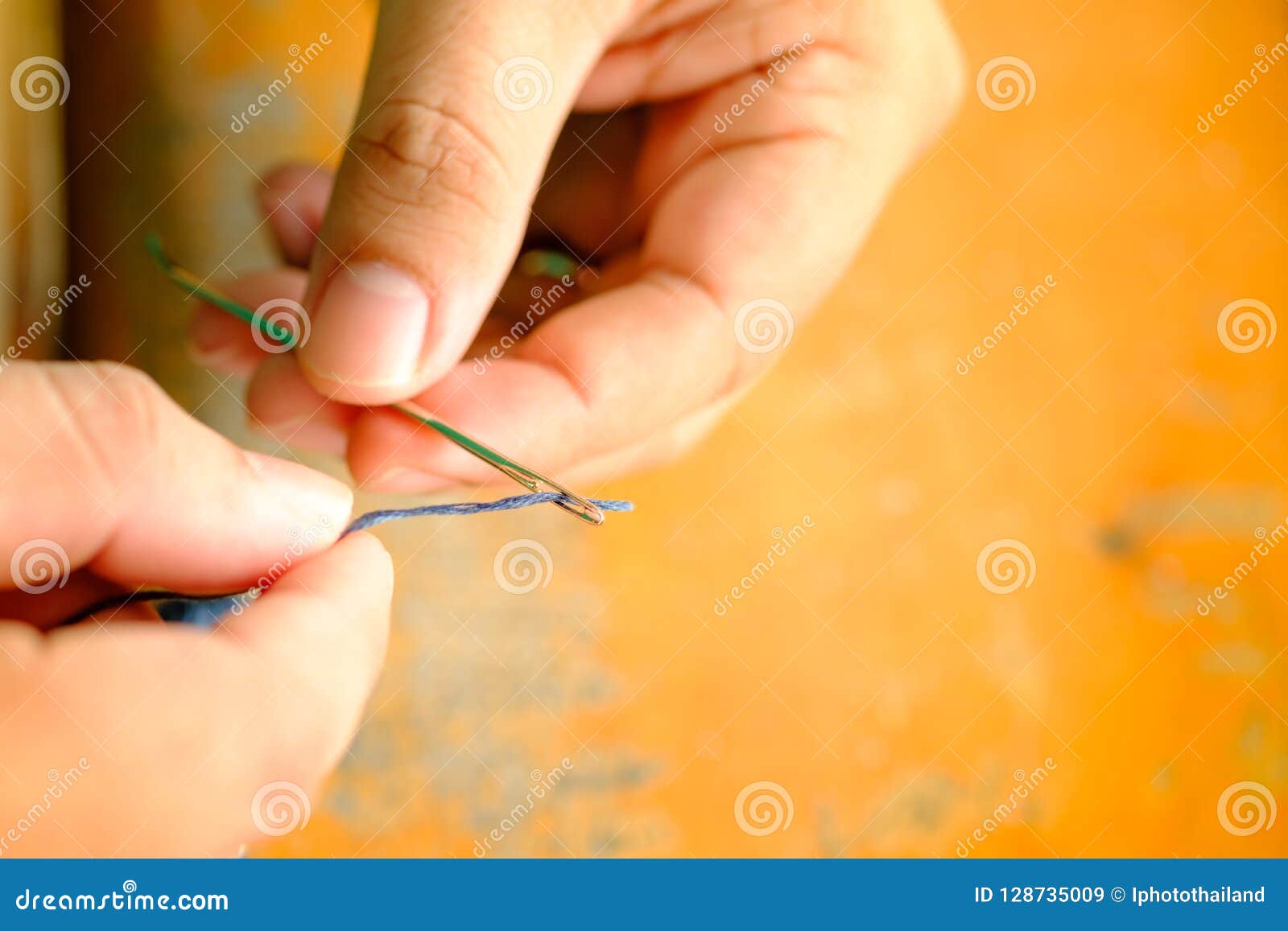Close Up Shot of Thread Insert into a Needle on Human Finger. Co Stock ...