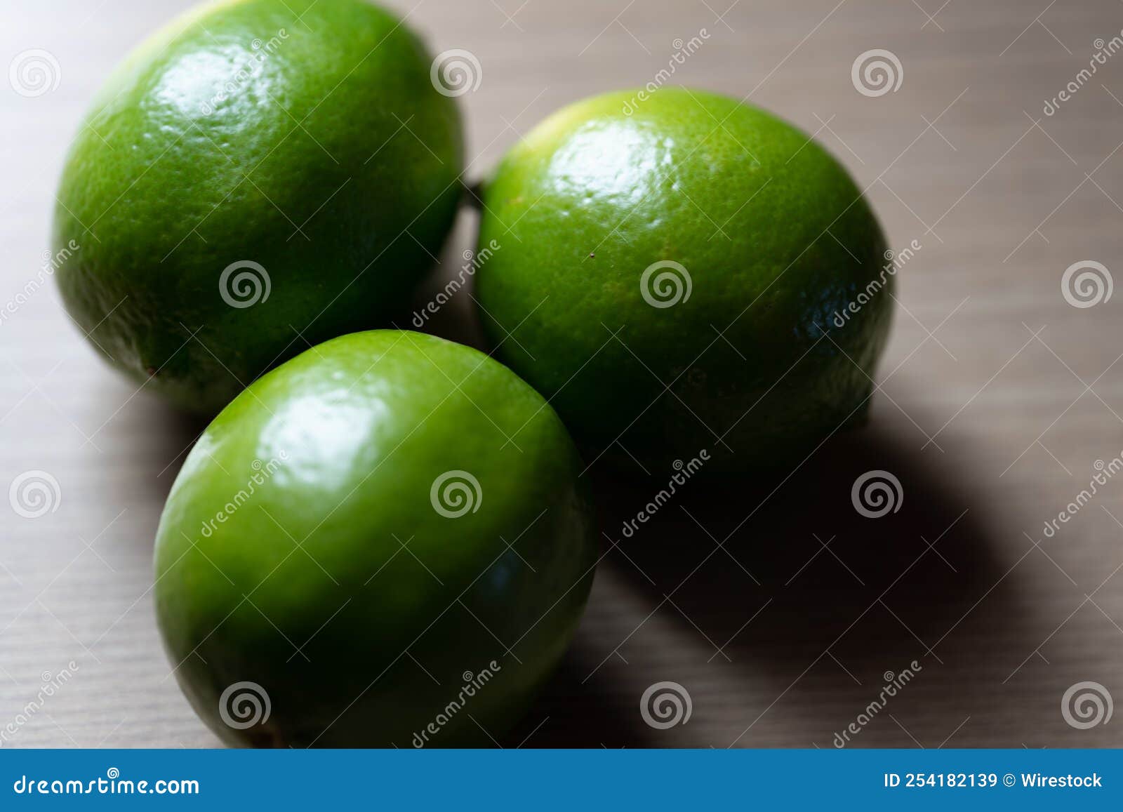 Close-up Shot of Three Limes on a Table Stock Image - Image of fruit ...