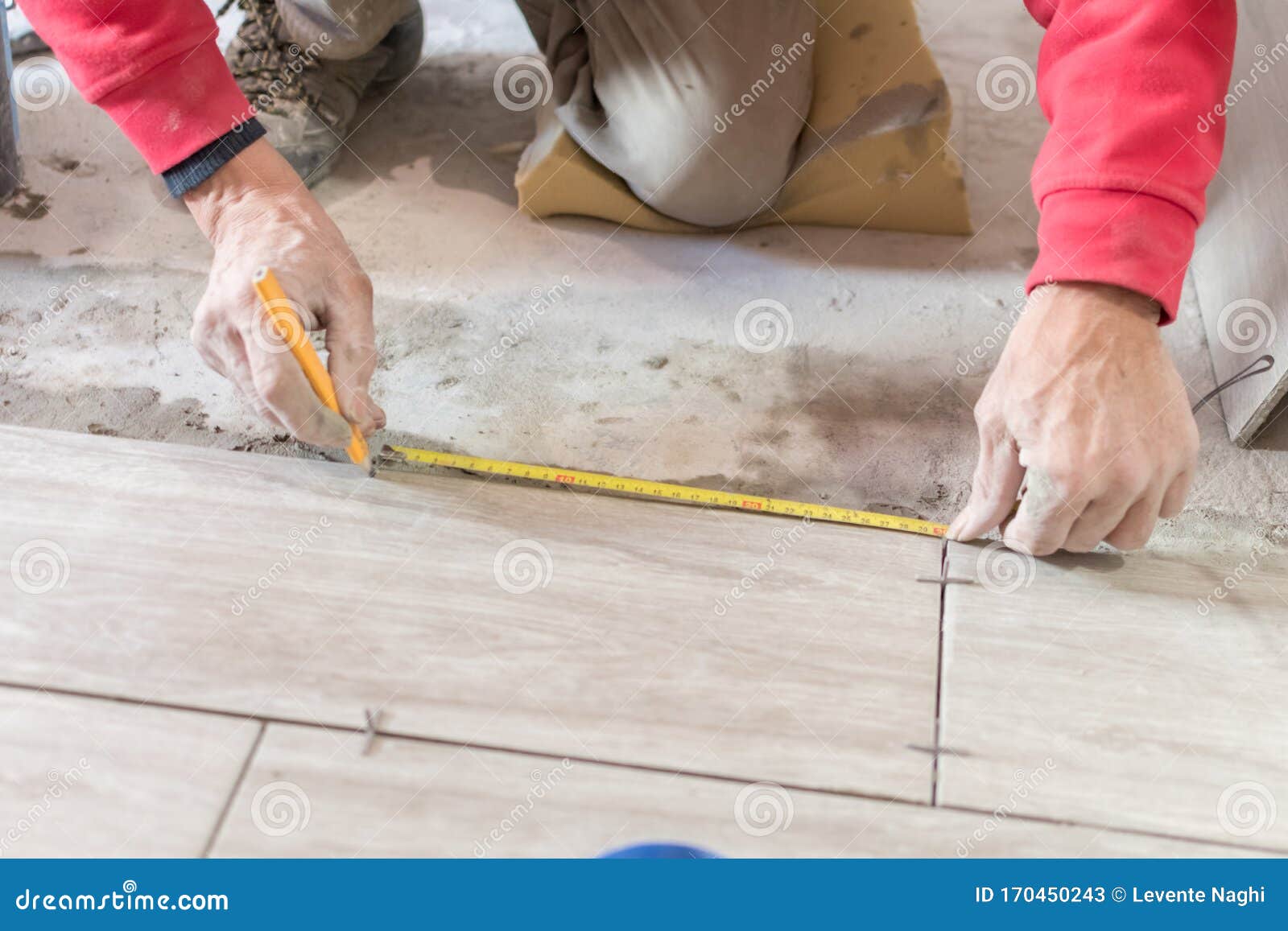 Close Up Shot of Unfinished Floor Tiles Installation in Kitchen ...