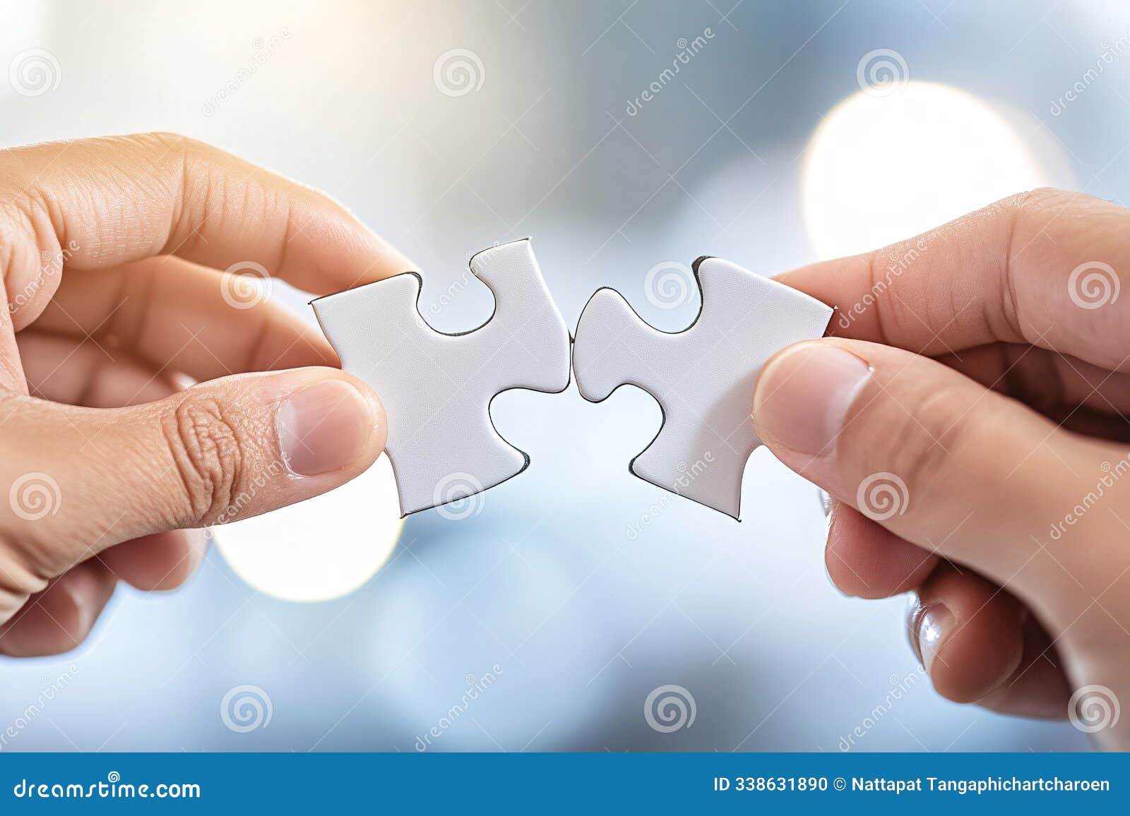 A Close-up Shows a Teams Hands Holding a Puzzle Piece Together ...