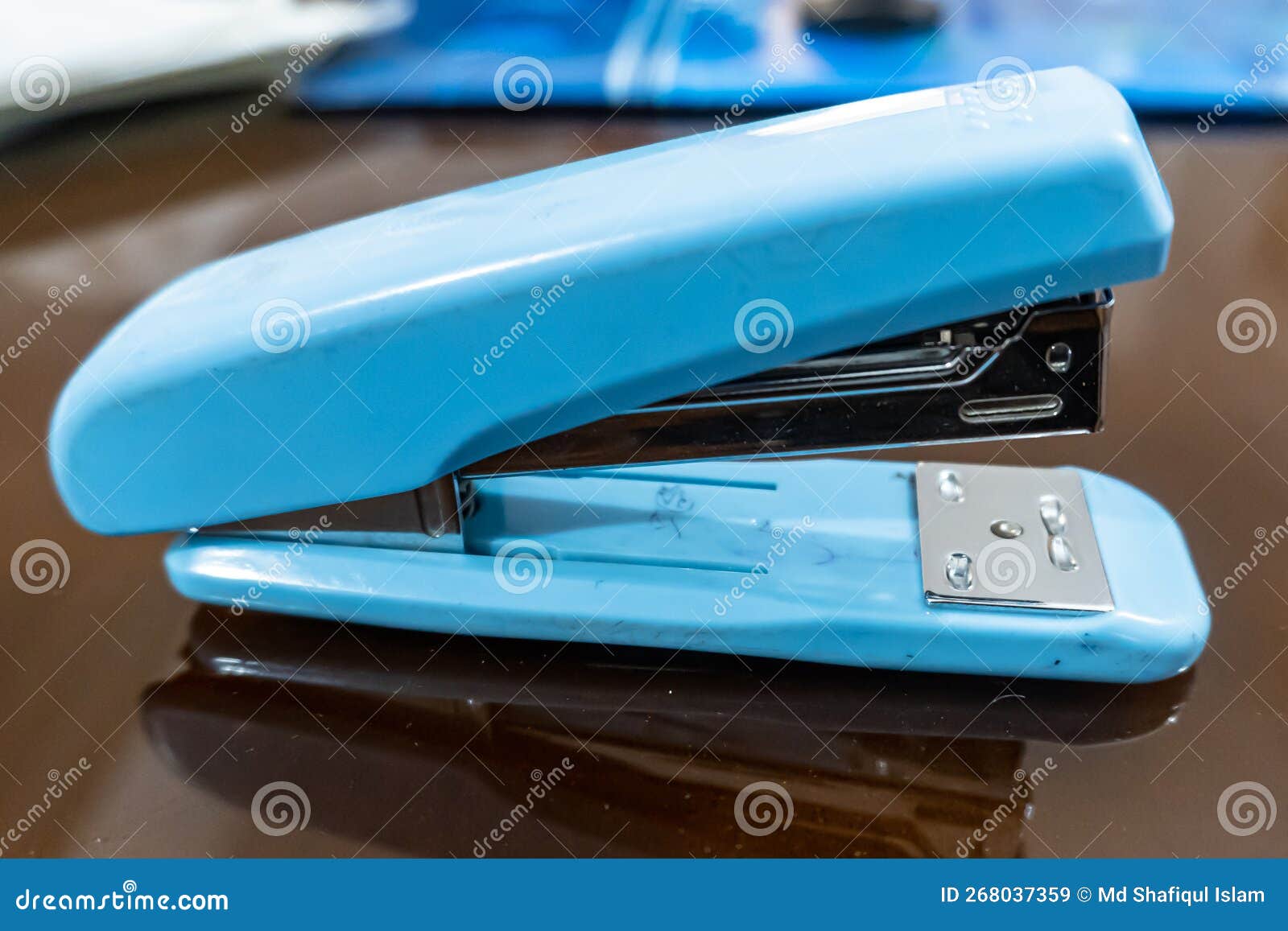 Close Up Side View of Light Blue Stapler Isolated on Glass Background ...