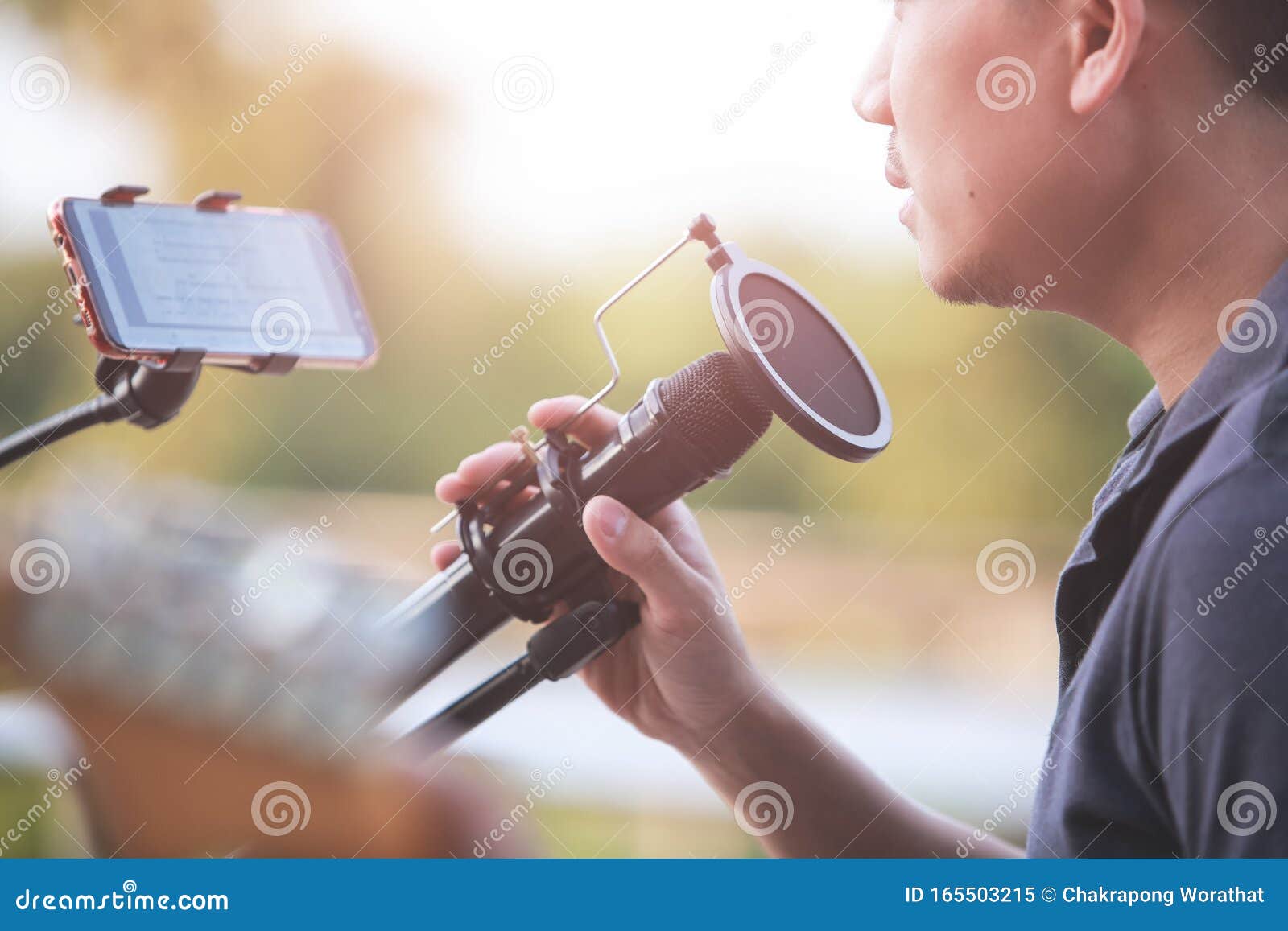 Close-up Singer Holding a Microphone Stand and Performing Stock Image ...