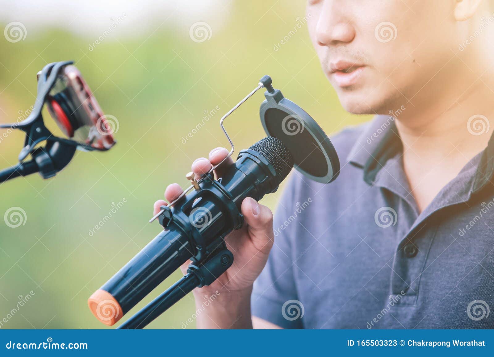 Close-up Singer Holding a Microphone Stand and Performing Stock Image ...