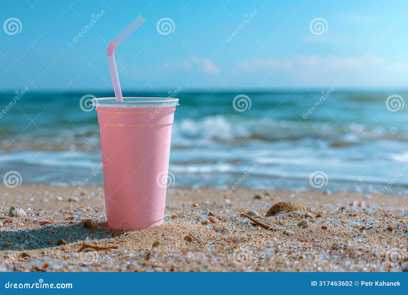 Close-up of a Single-use Plastic Straw on a Beach, Symbolizing ...