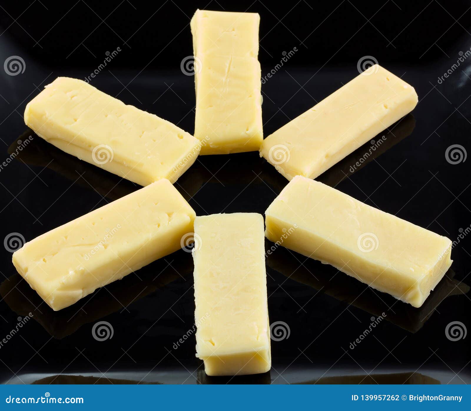 A Close Up of Six of Small Cheddar Cheese Pieces. Stock Photo - Image ...