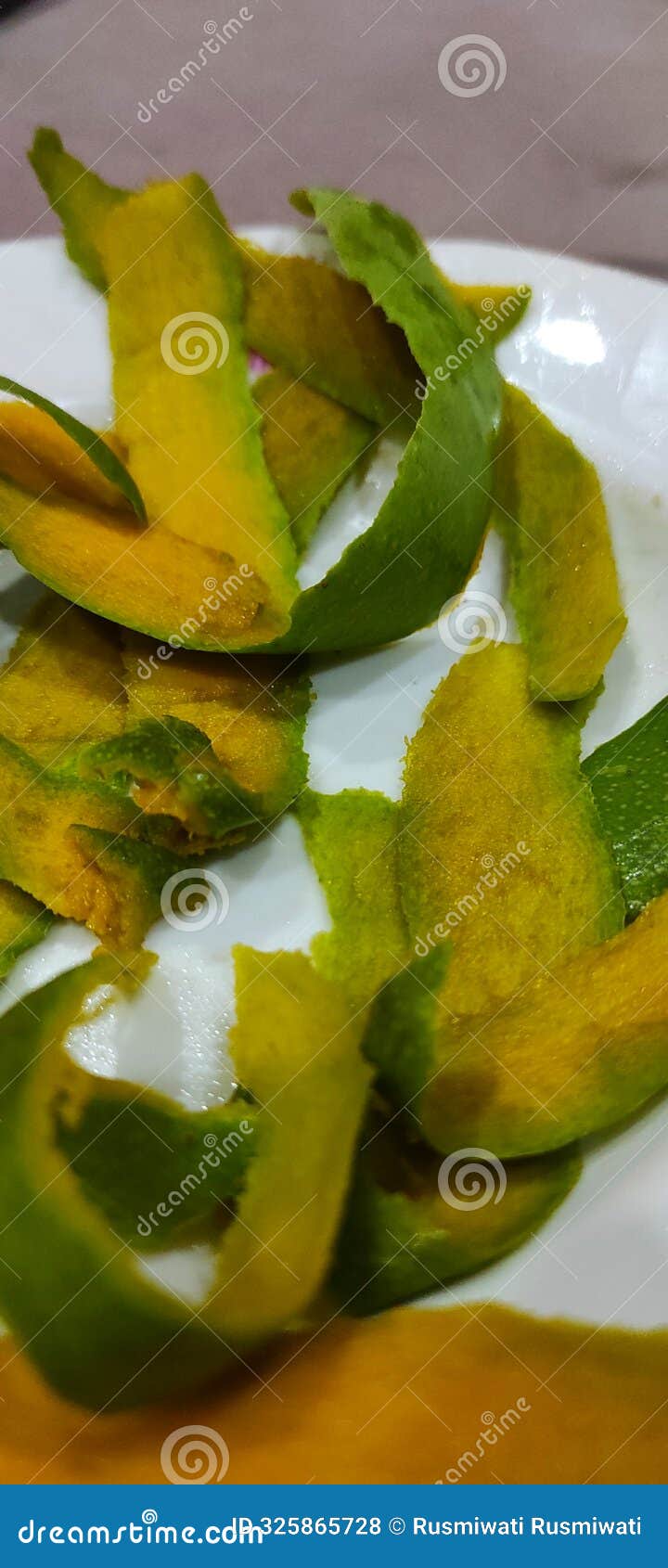 The Skin of a Peeled Mango on a Plate Stock Photo - Image of delicious ...