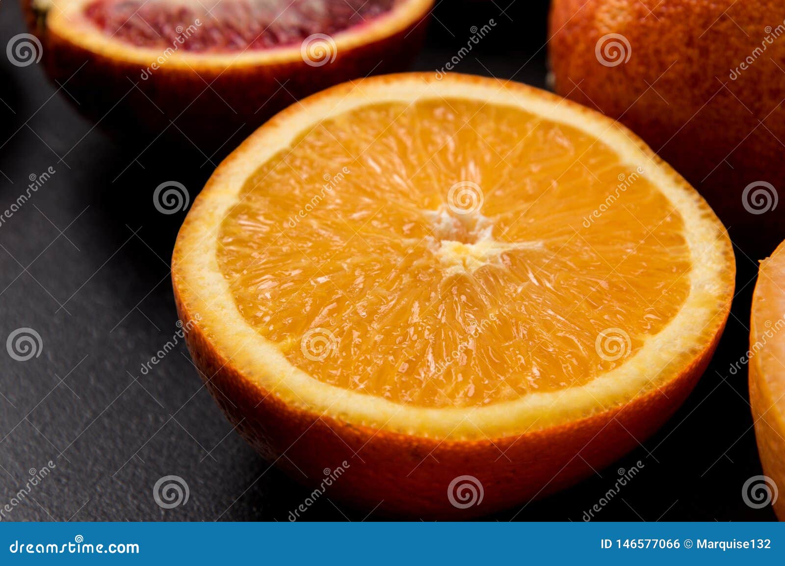 Close Up. Sliced in Half Orange on a Black Background Stock Photo ...