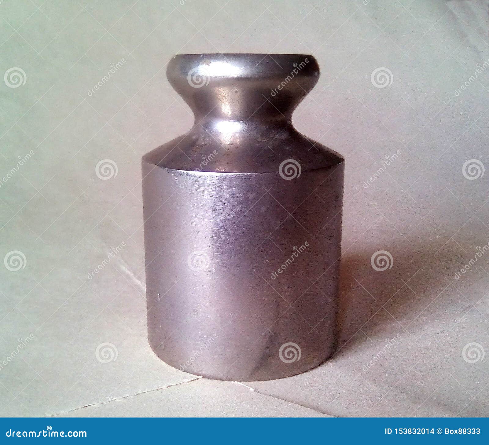 Close-up of a Small Metal Weight for Scales. Light Silver Metal on a ...