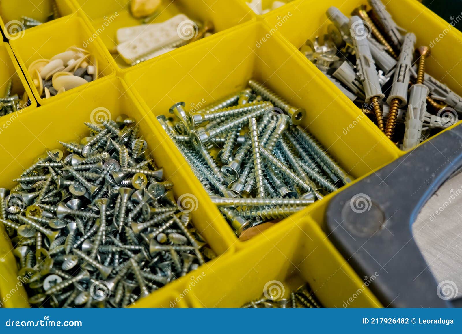 Close-up of Small Plastic Yellow Boxes with Different Screws and ...