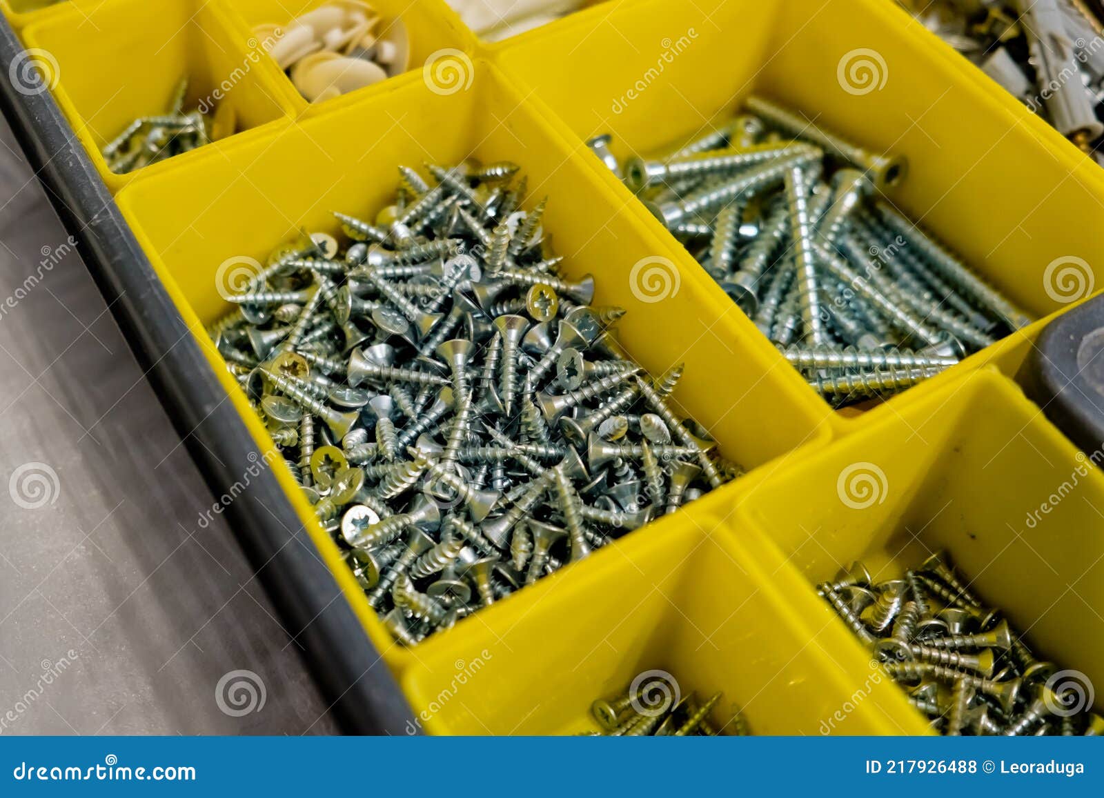 Close-up of Small Plastic Yellow Boxes with Different Screws and ...
