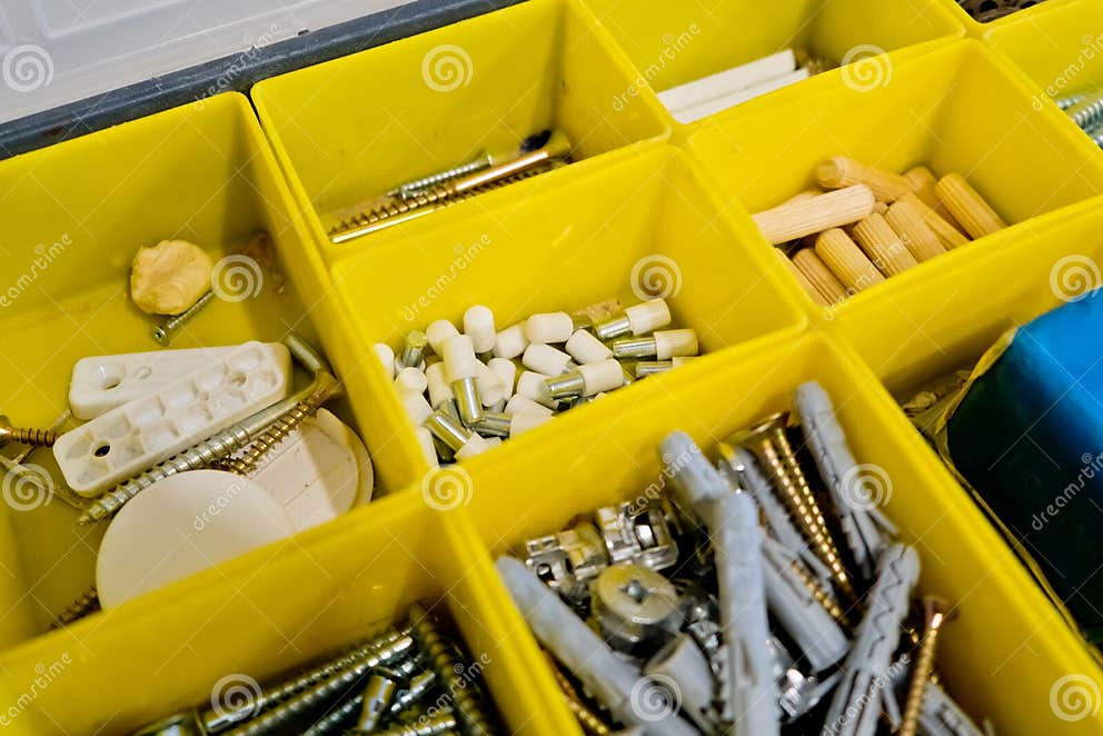 Close-up of Small Plastic Yellow Boxes with Different Screws and ...