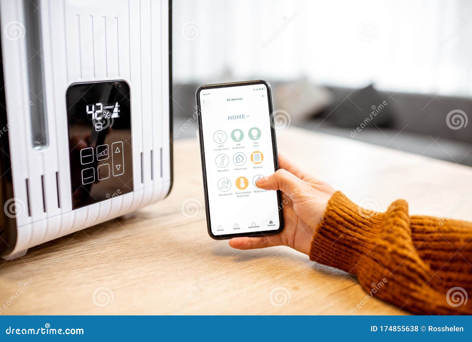 Controlling Smart Air Humidifier with Phone Remotely at Home Stock ...