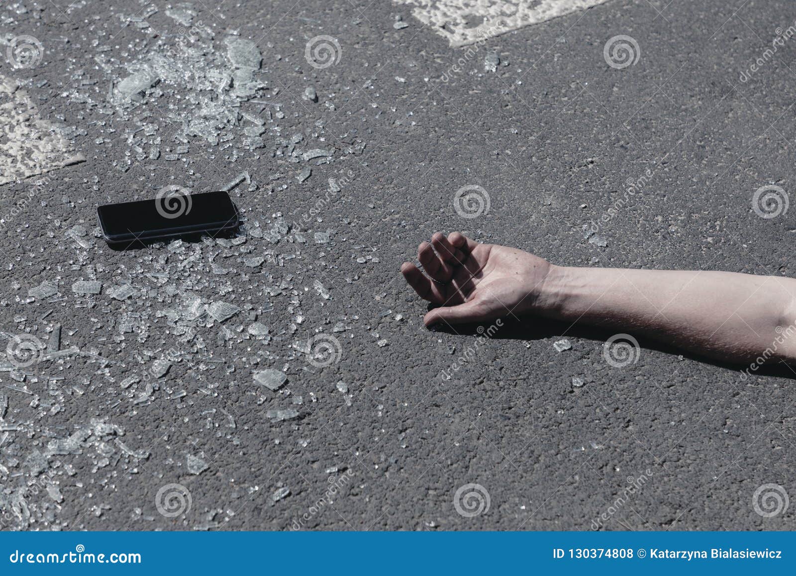 Smartphone and Hand of a Victim after Traffic Accident Stock Photo ...