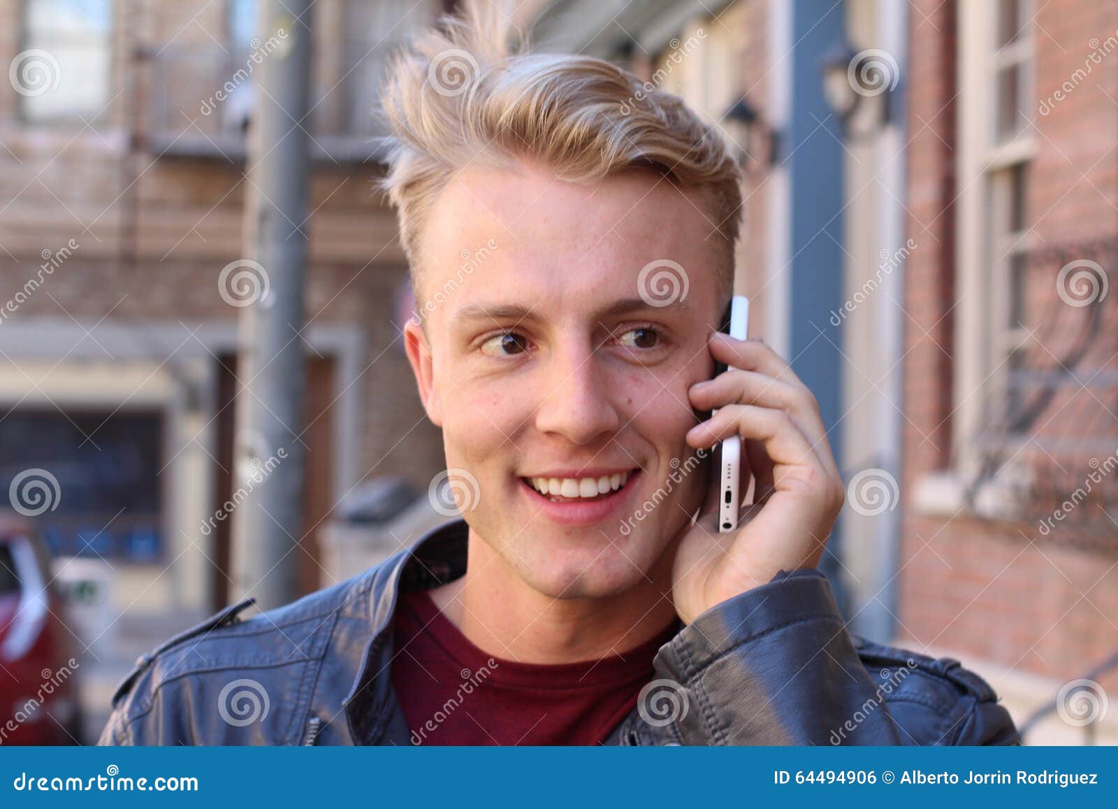Close Up Smiling Attractive Young Guy Talking To Someone Using Mobile ...
