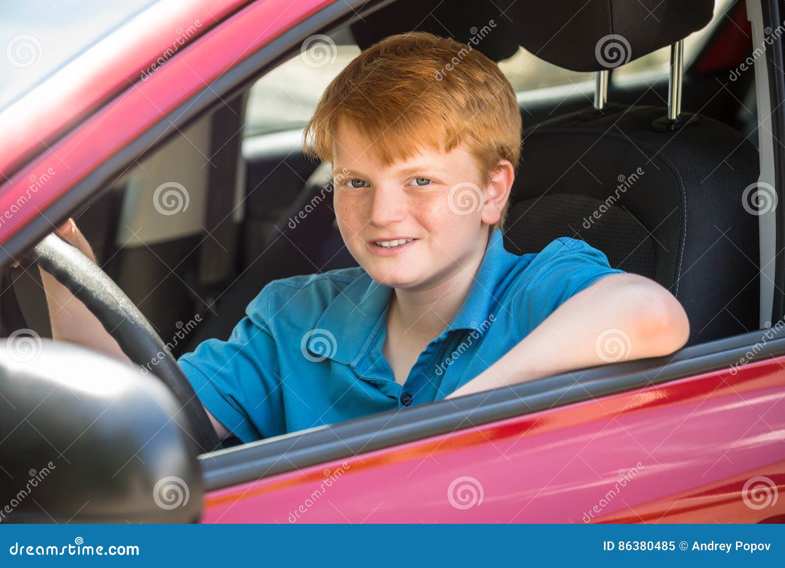 Boy Sitting Inside Car stock image. Image of outdoors - 86380485