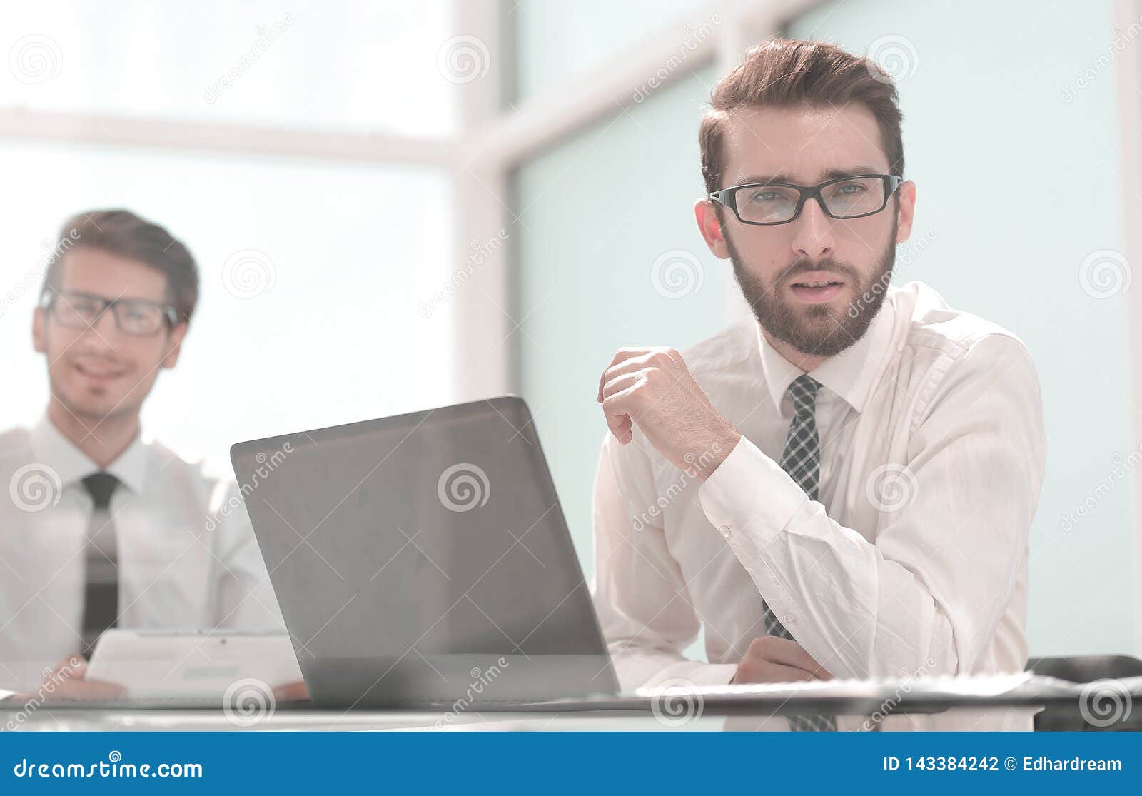 Close Up.smiling Business Colleagues Sitting at the Desk Stock Photo ... Close Up.smiling Business Colleagues Sitting at the Desk Stock Photo ...