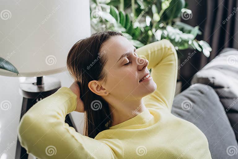 Close Up of Smiling Peaceful Young Woman with Closed Eyes Relaxing on ... Close Up of Smiling Peaceful Young Woman with Closed Eyes Relaxing on ...