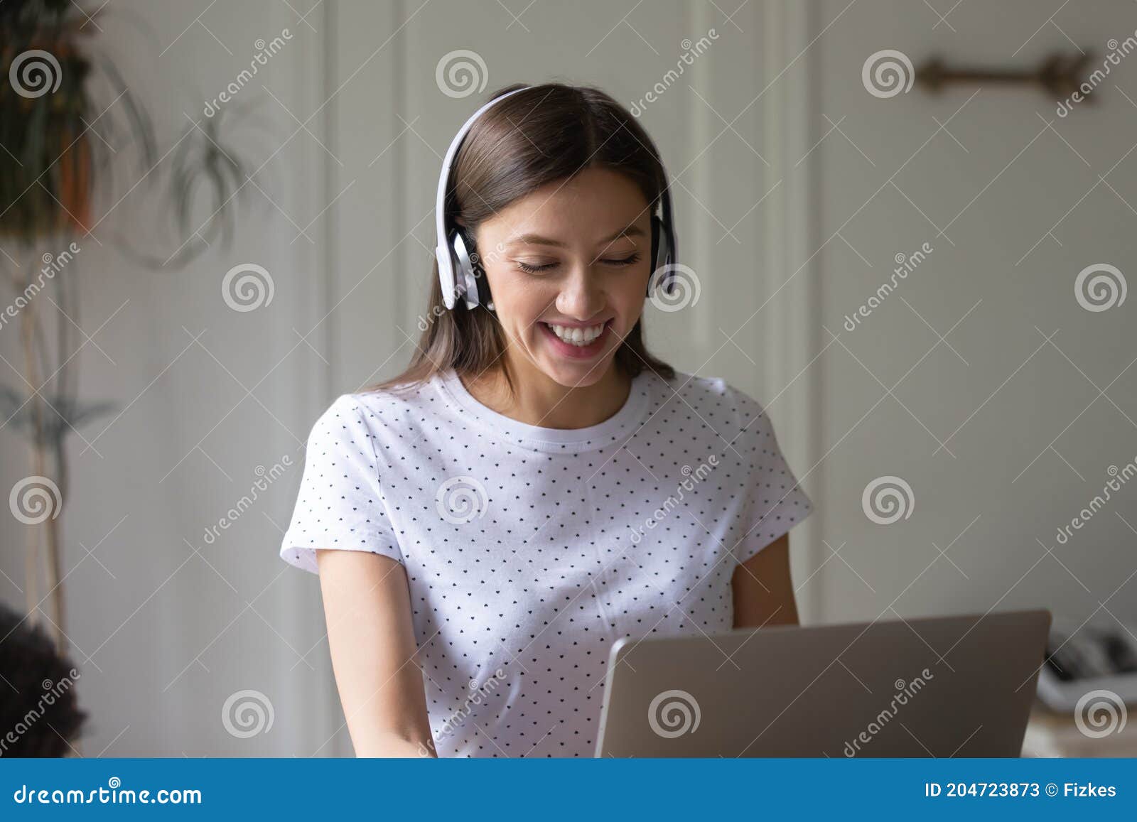 Close Up Smiling Woman Wearing Headphones Using Laptop Working Online