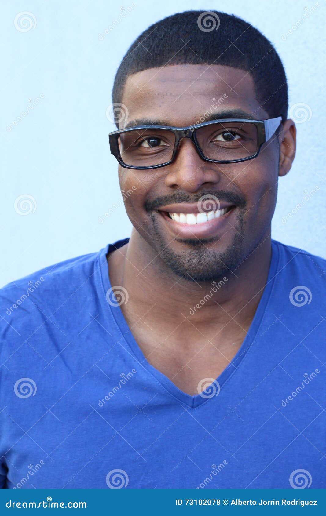 Close Up Smiling Young Black Man Wearing Eyeglasses Looking At The