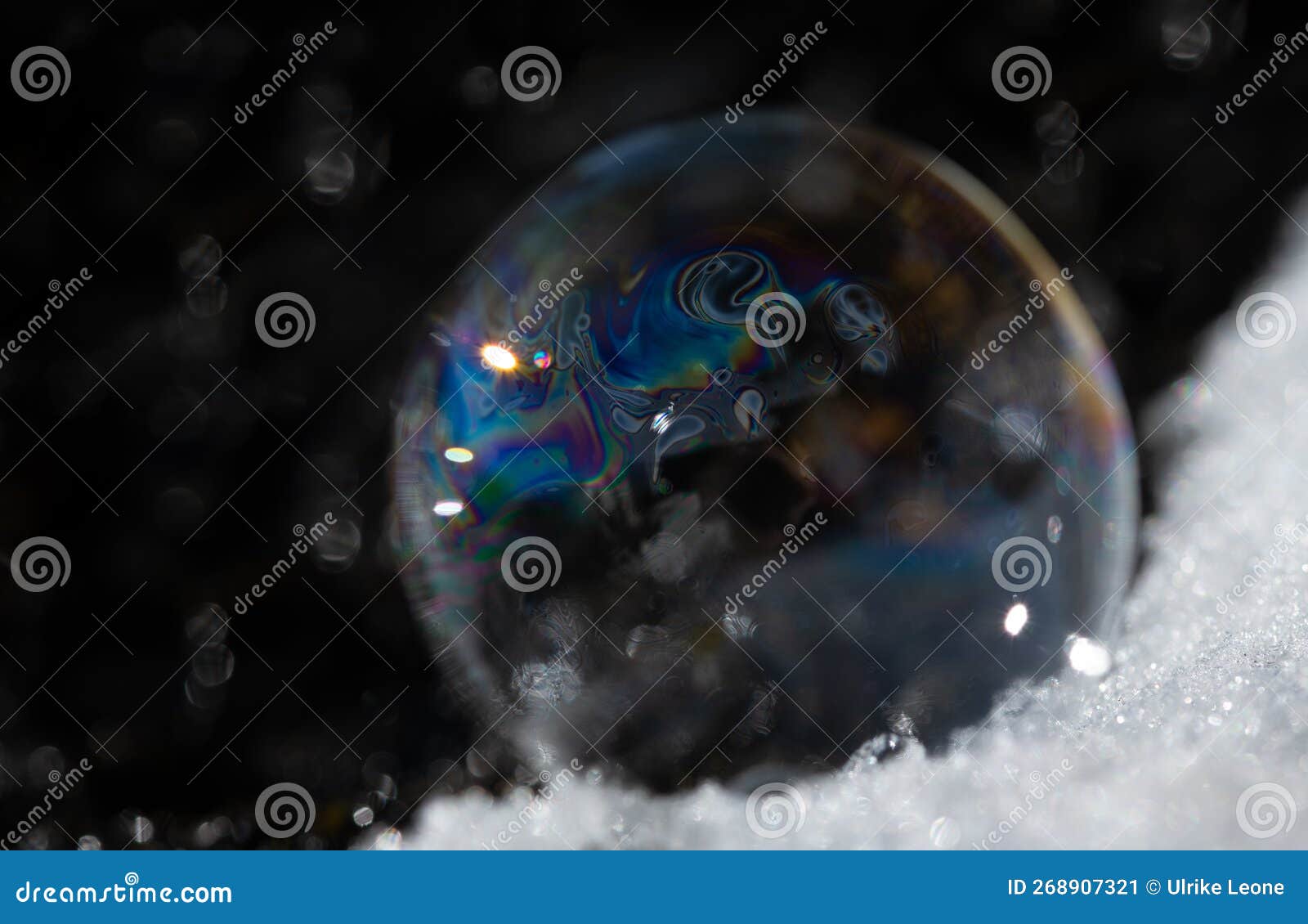 Close-up of a Soap Bubble Lying on Snow. the Background is Dark. Light ...