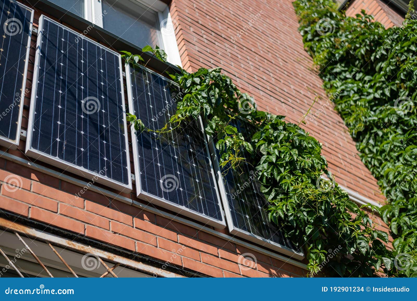Close-up of Solar Panels on a Red Brick Wall. Alternative Energy Source ...